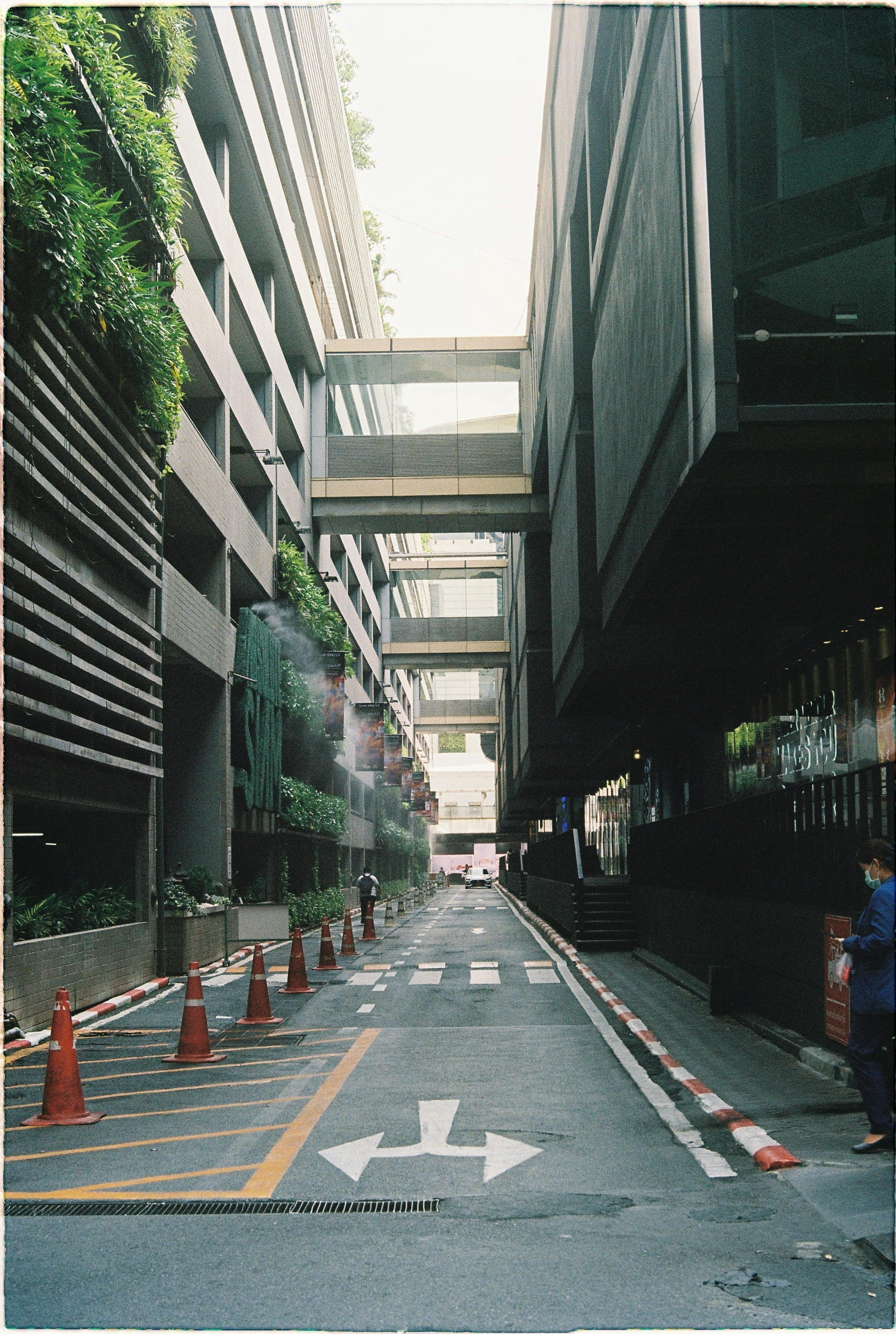 Narrow Street between Concrete Buildings · Free Stock Photo