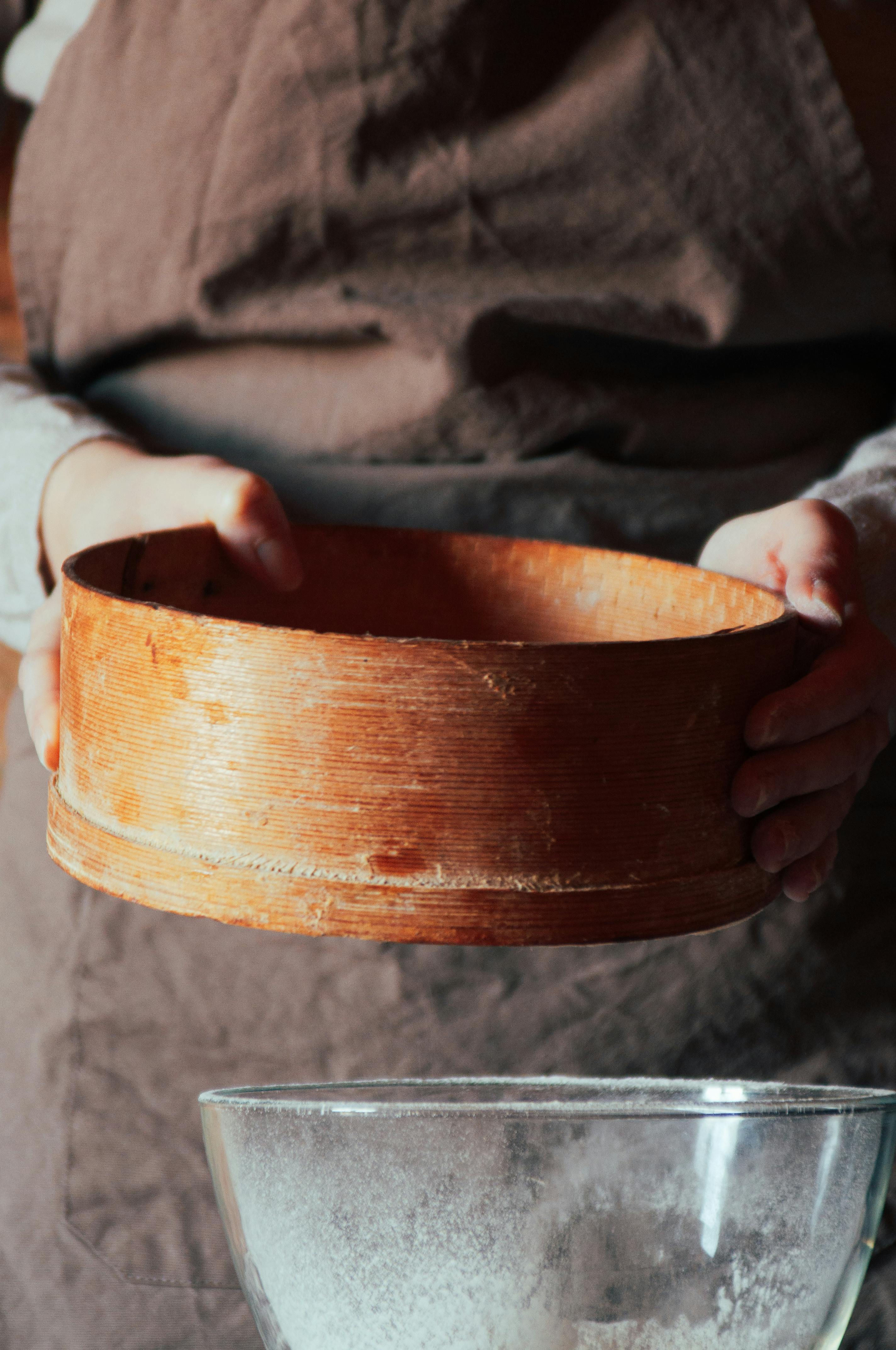 Woman Hands Holding Tray over Pot · Free Stock Photo