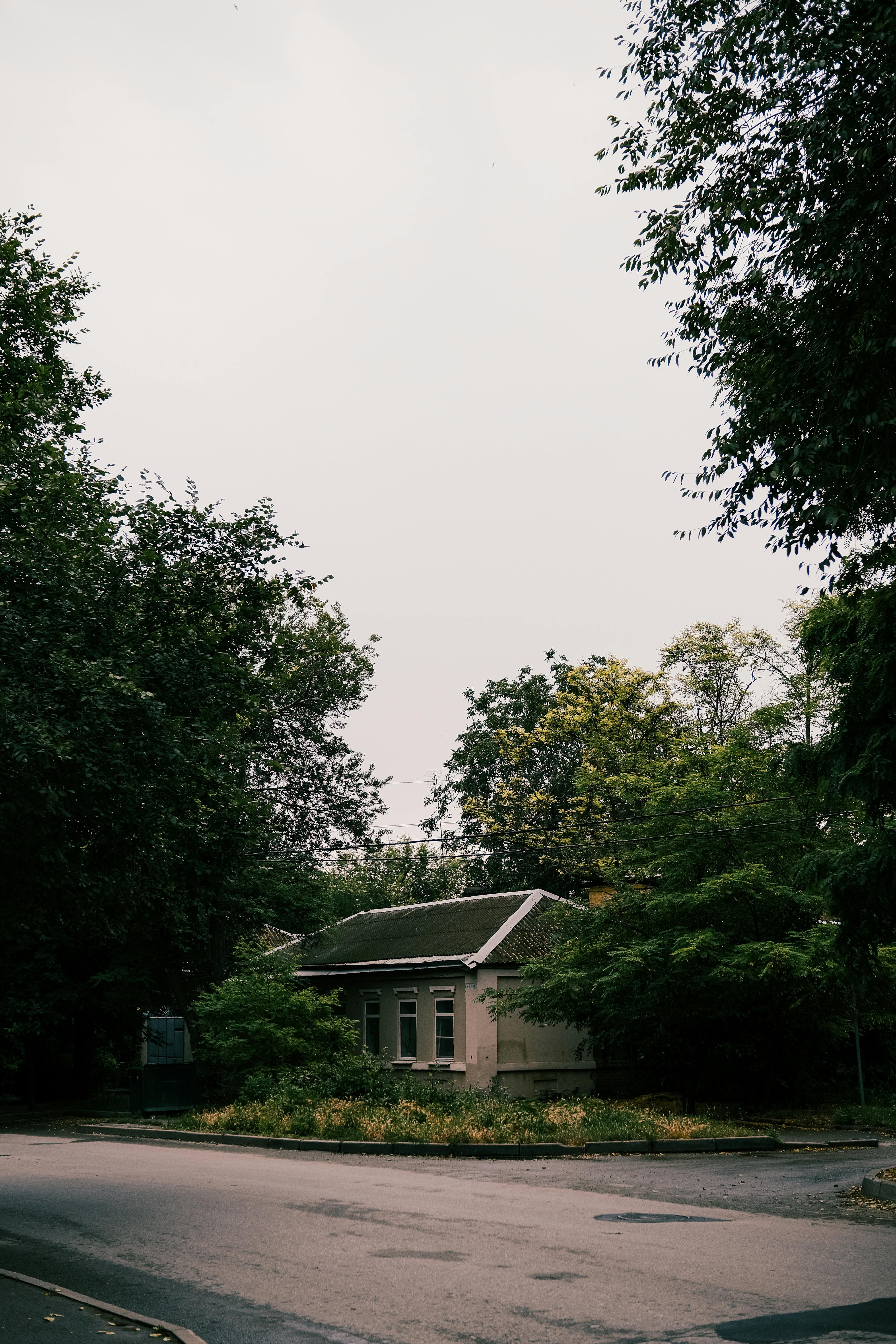 House Among Trees at the Crossroads · Free Stock Photo