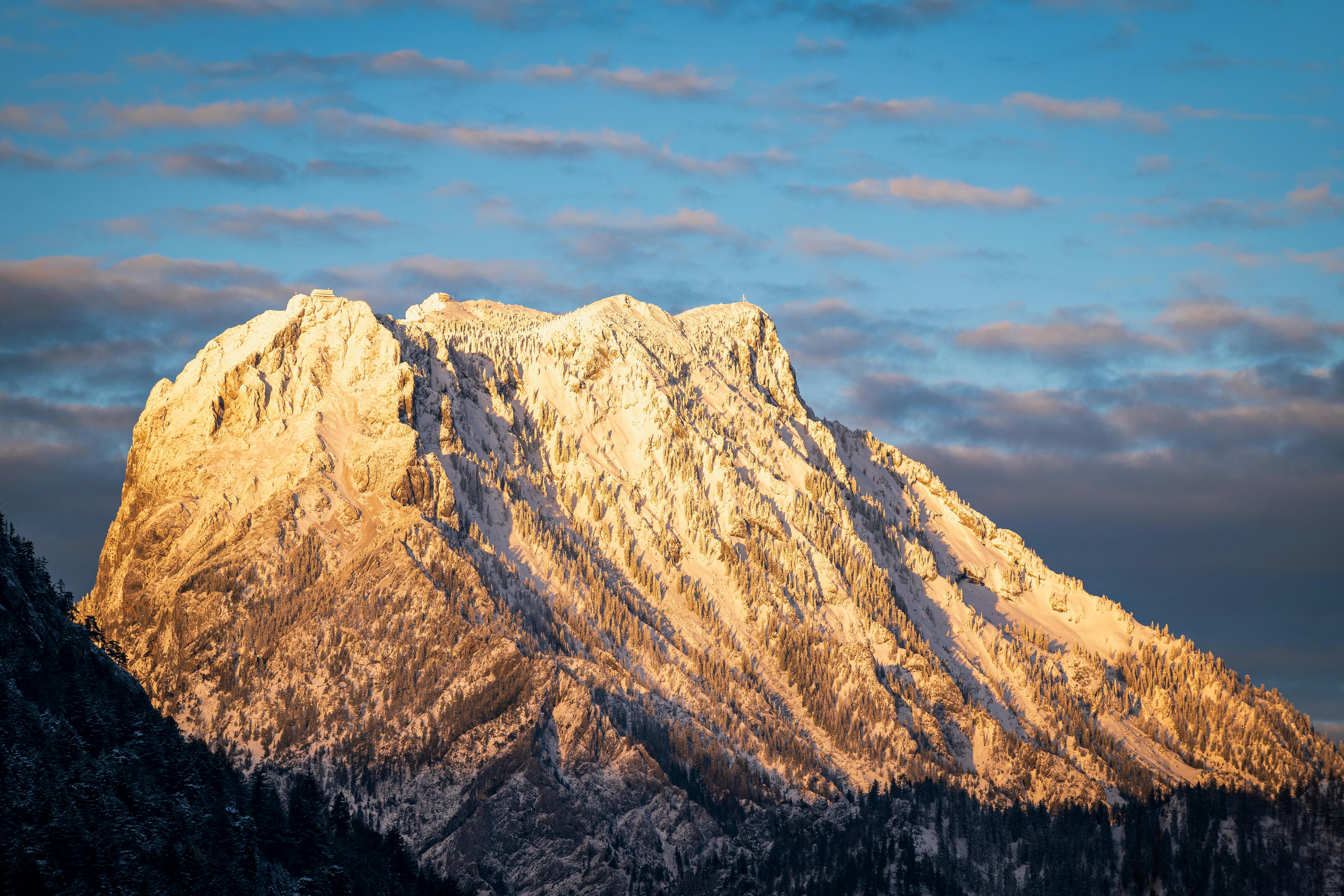 Steep Rocky Mountain Covered with Snow · Free Stock Photo