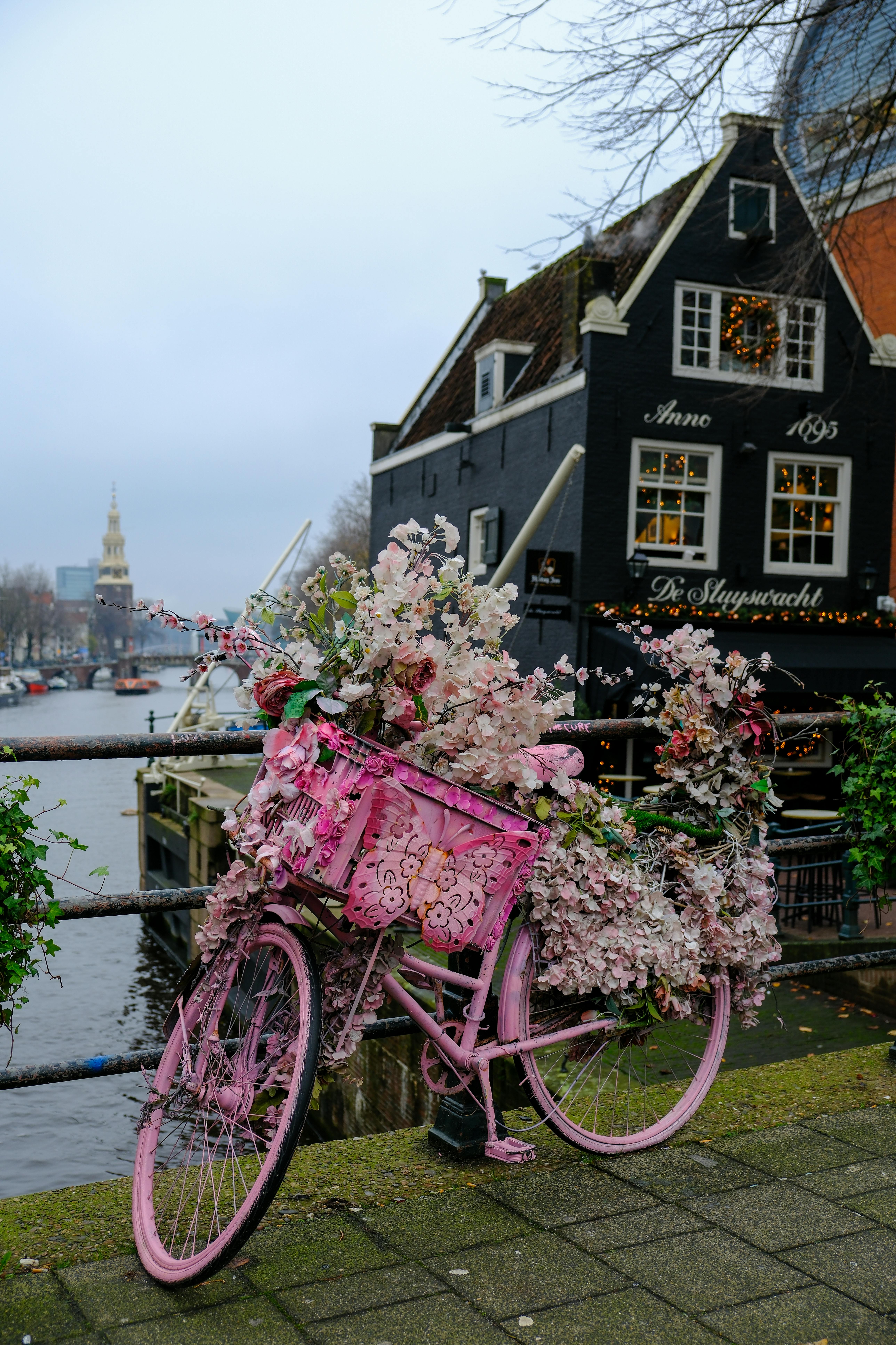 Pink Bike with Flowers on Footbridge · Free Stock Photo