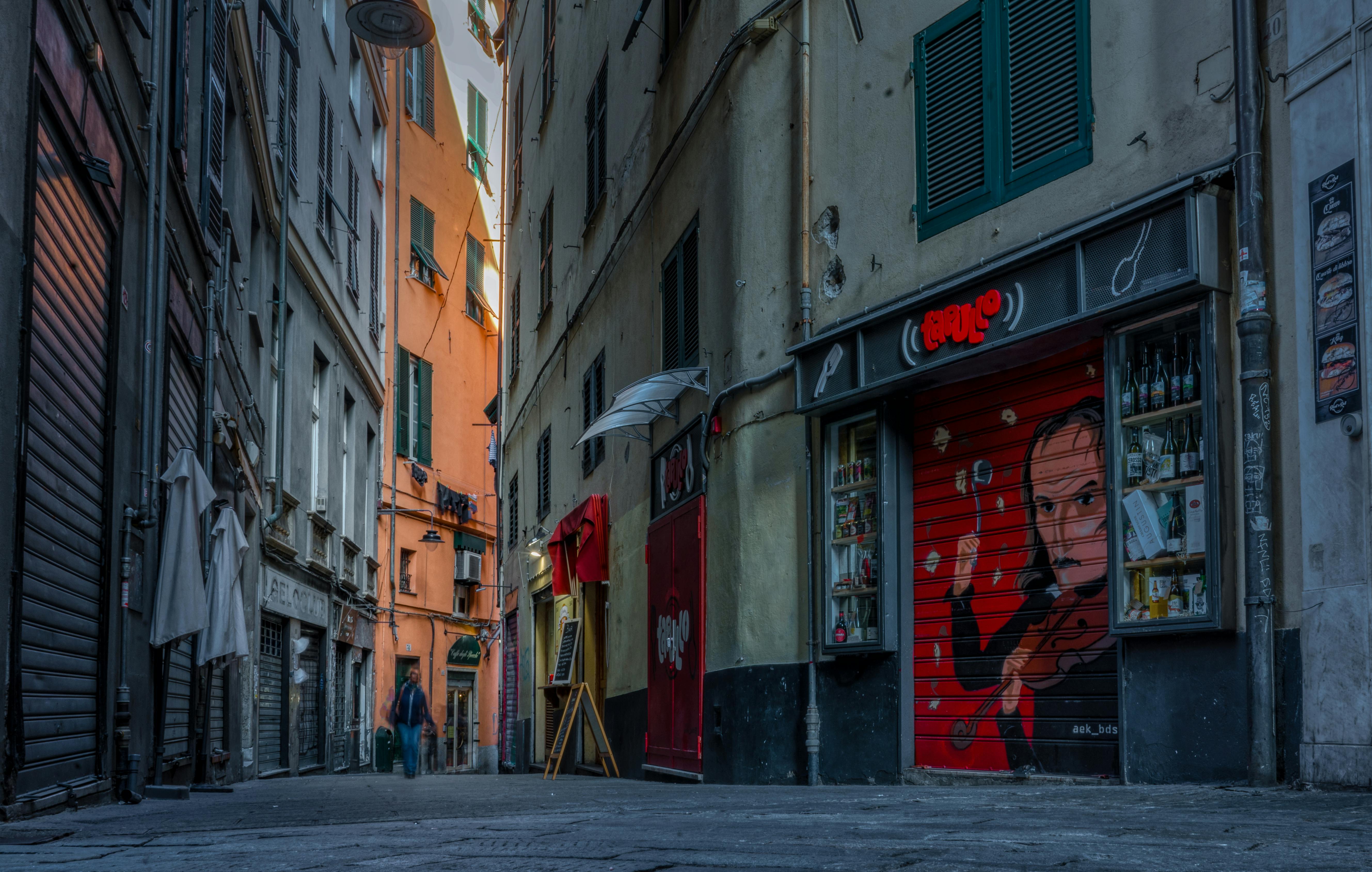 Residential Alley with a Closed Store in the Foreground · Free Stock Photo