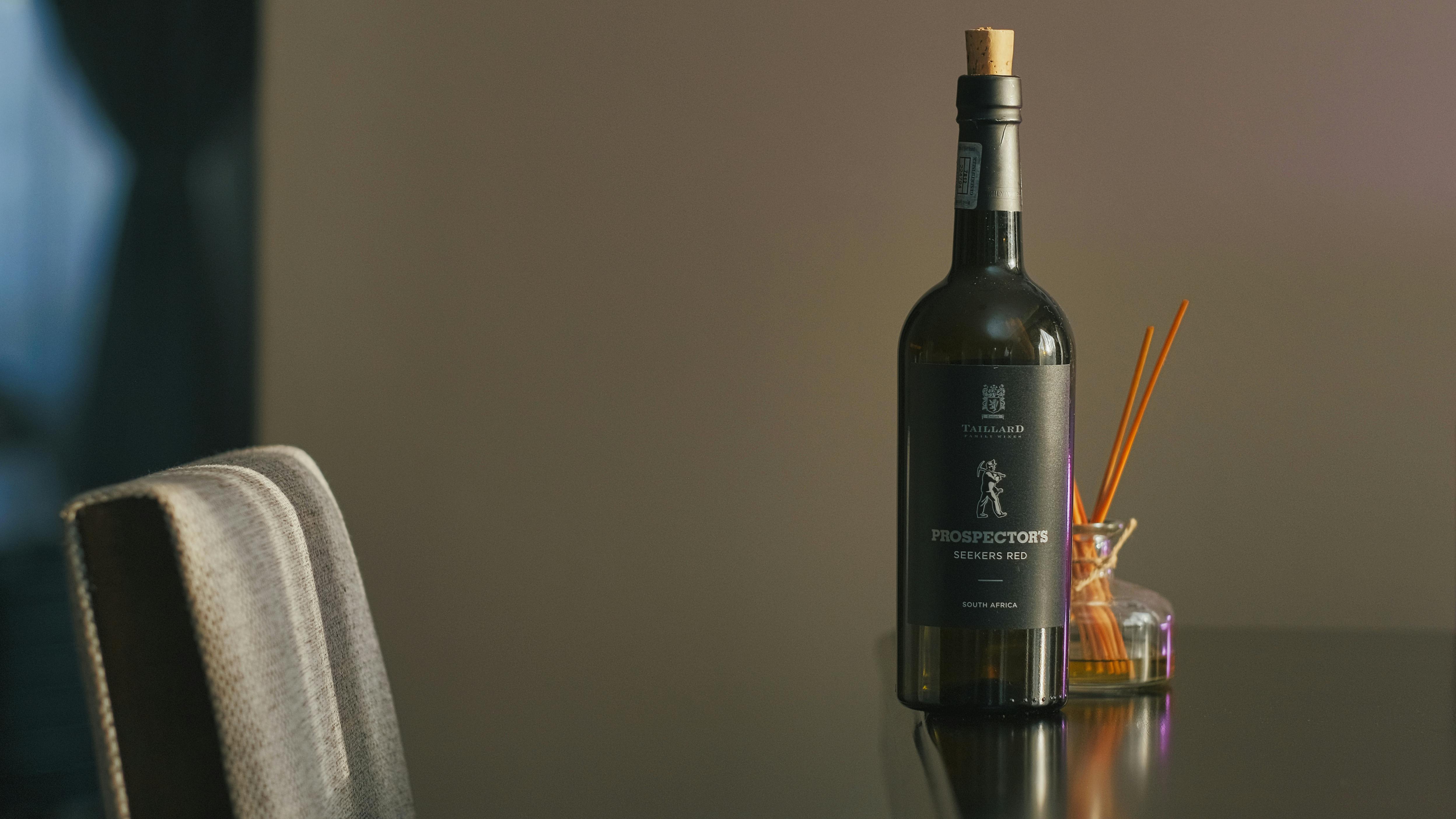 Elegant Bottle of Red Wine on Stylish Table · Free Stock Photo