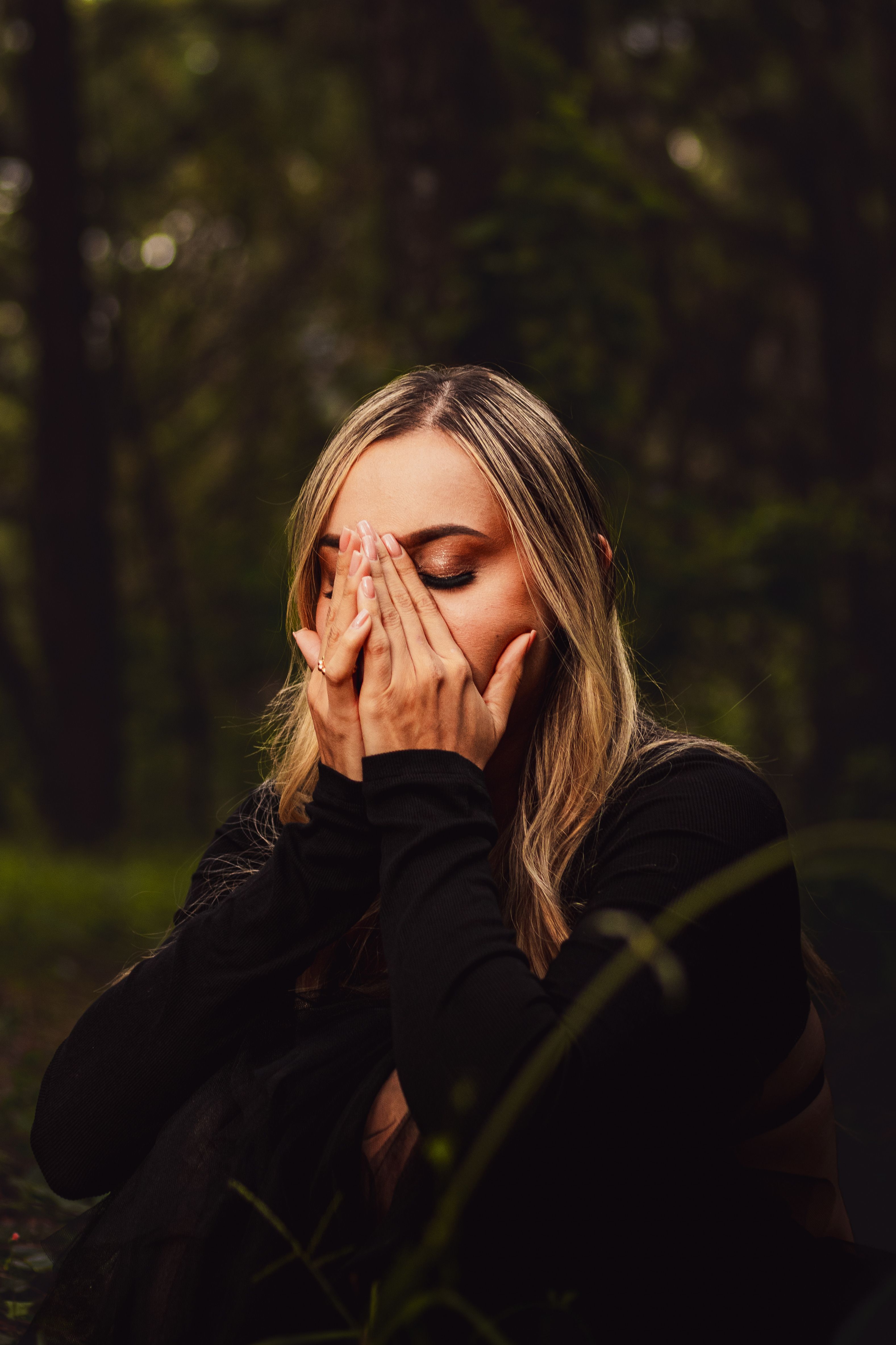 Blonde Woman Hiding Face in Hands · Free Stock Photo