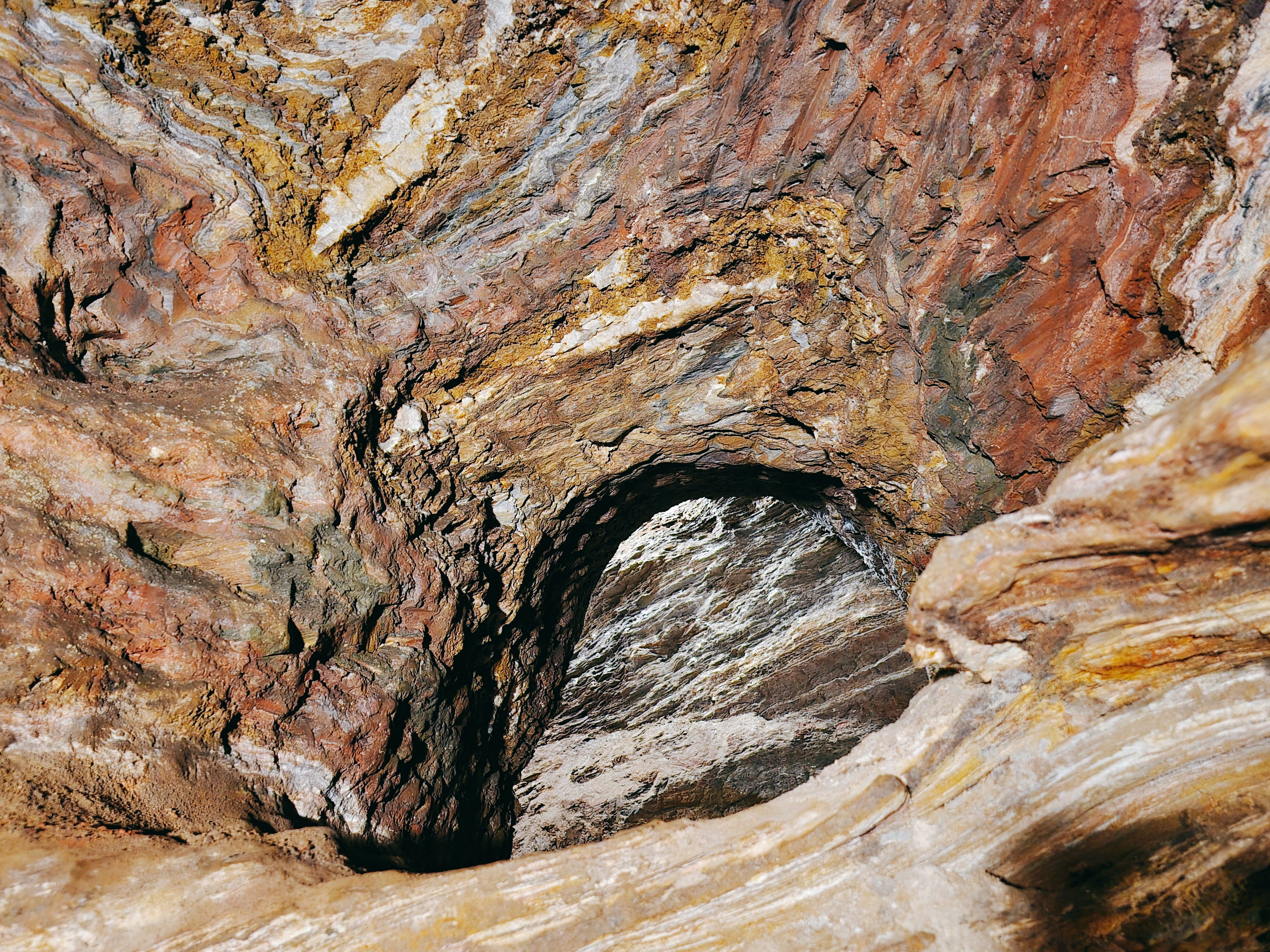 A cave with a large opening in it · Free Stock Photo