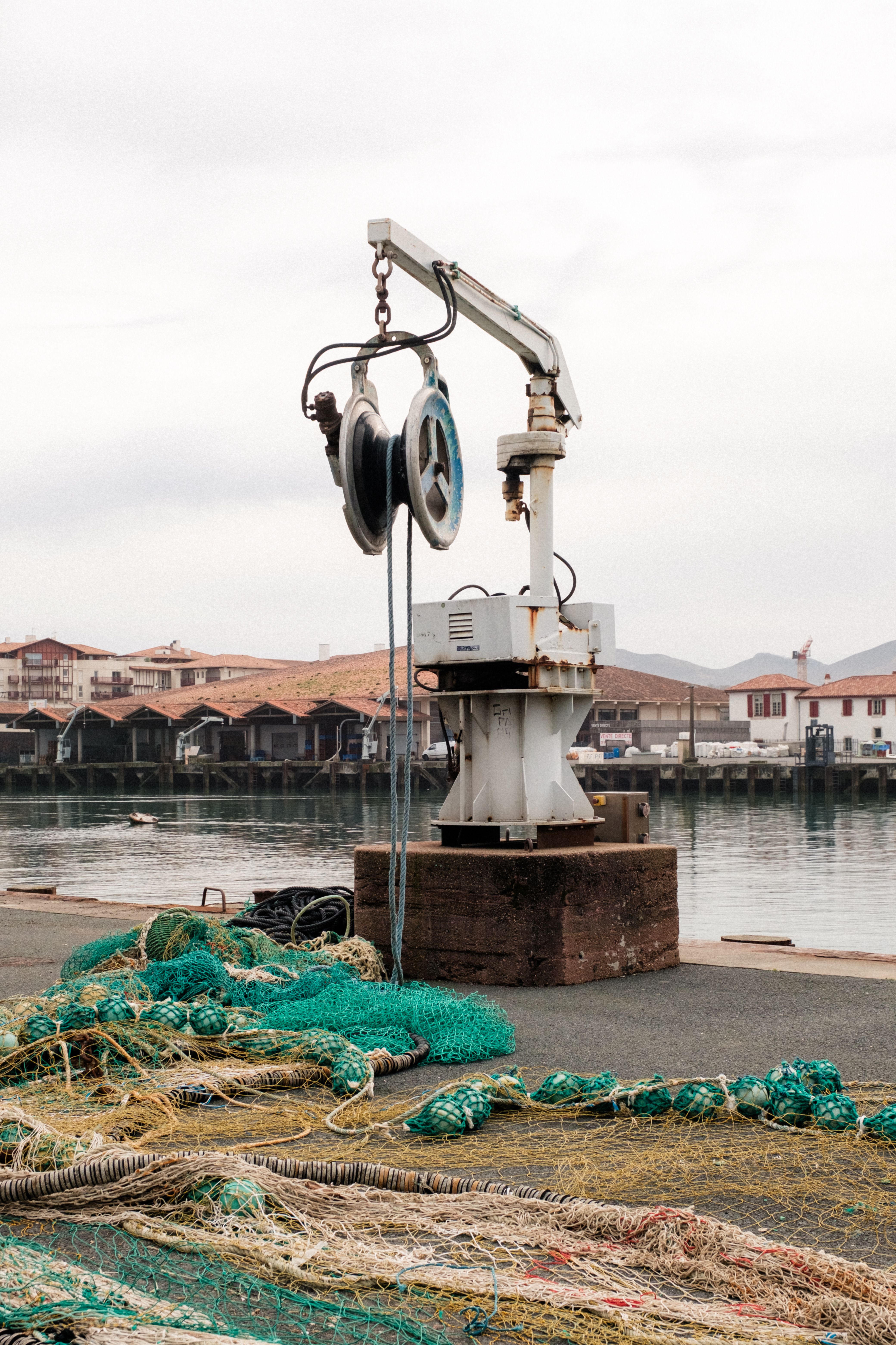Crane near River in Town · Free Stock Photo