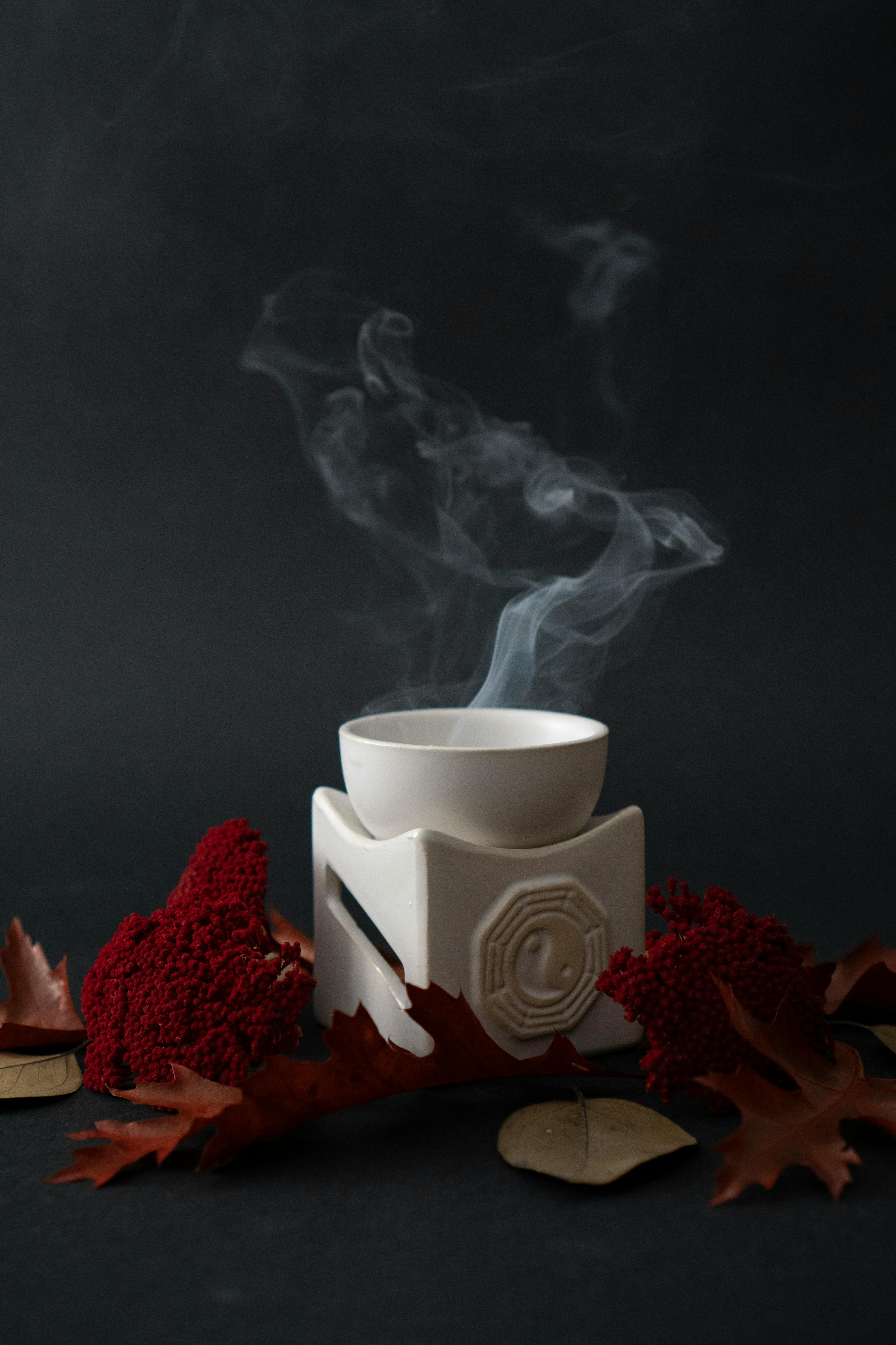 A white cup with smoke coming out of it · Free Stock Photo