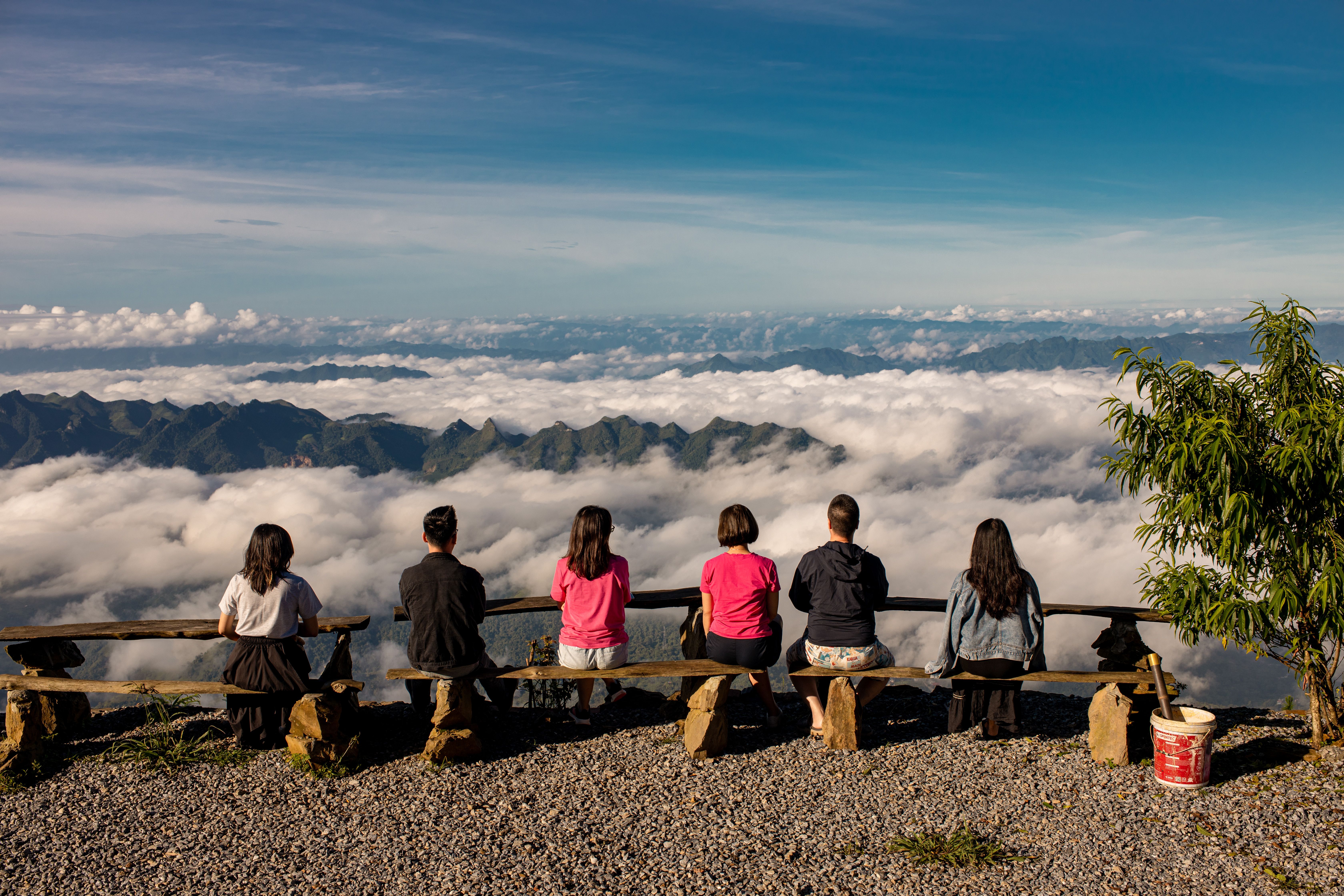 Group of People Sitting by Viewpoint in a Mountain Valley · Free Stock ...