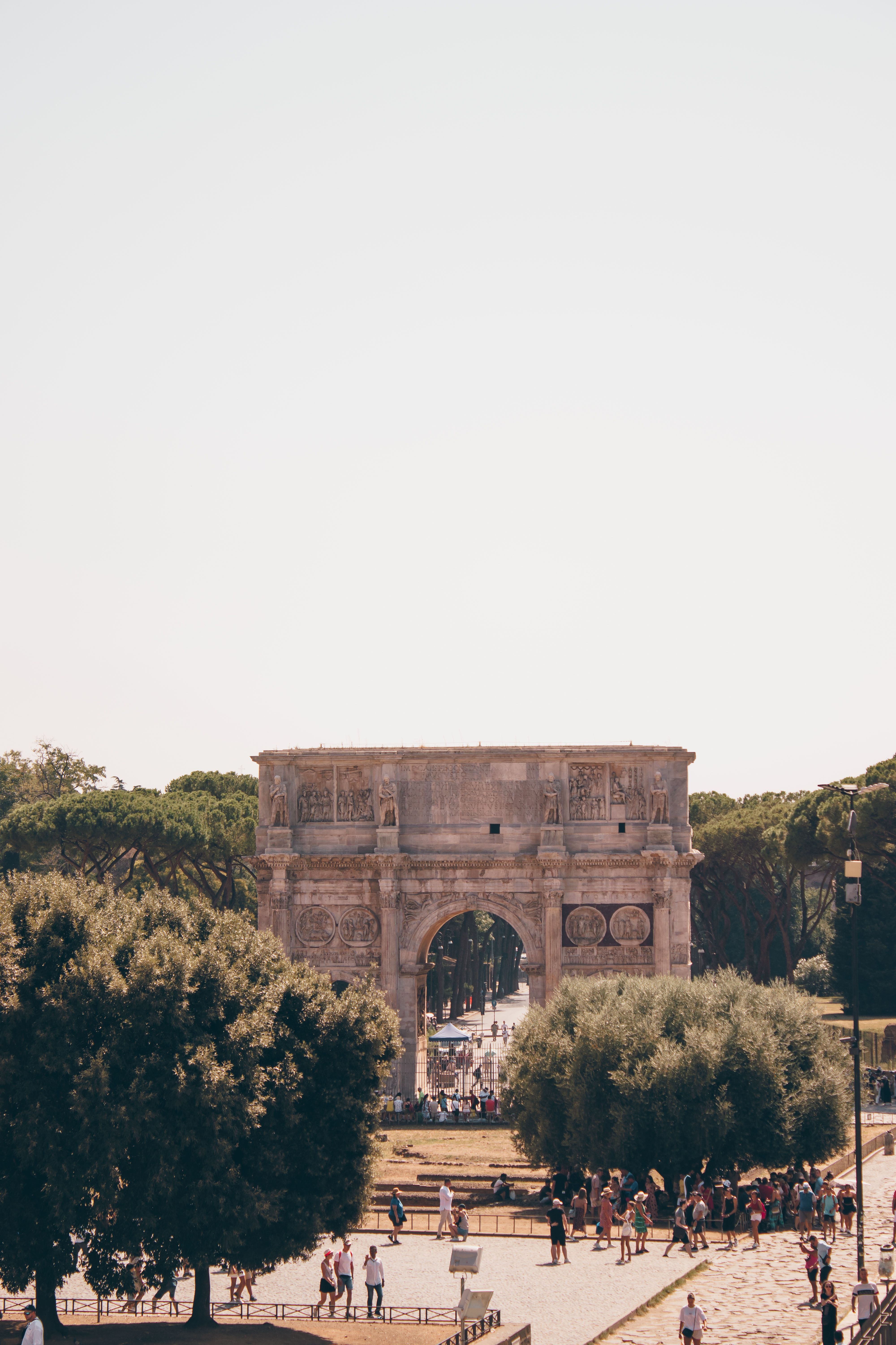 View of the Arch of Constantine behind Trees in Rome in Italy · Free ...