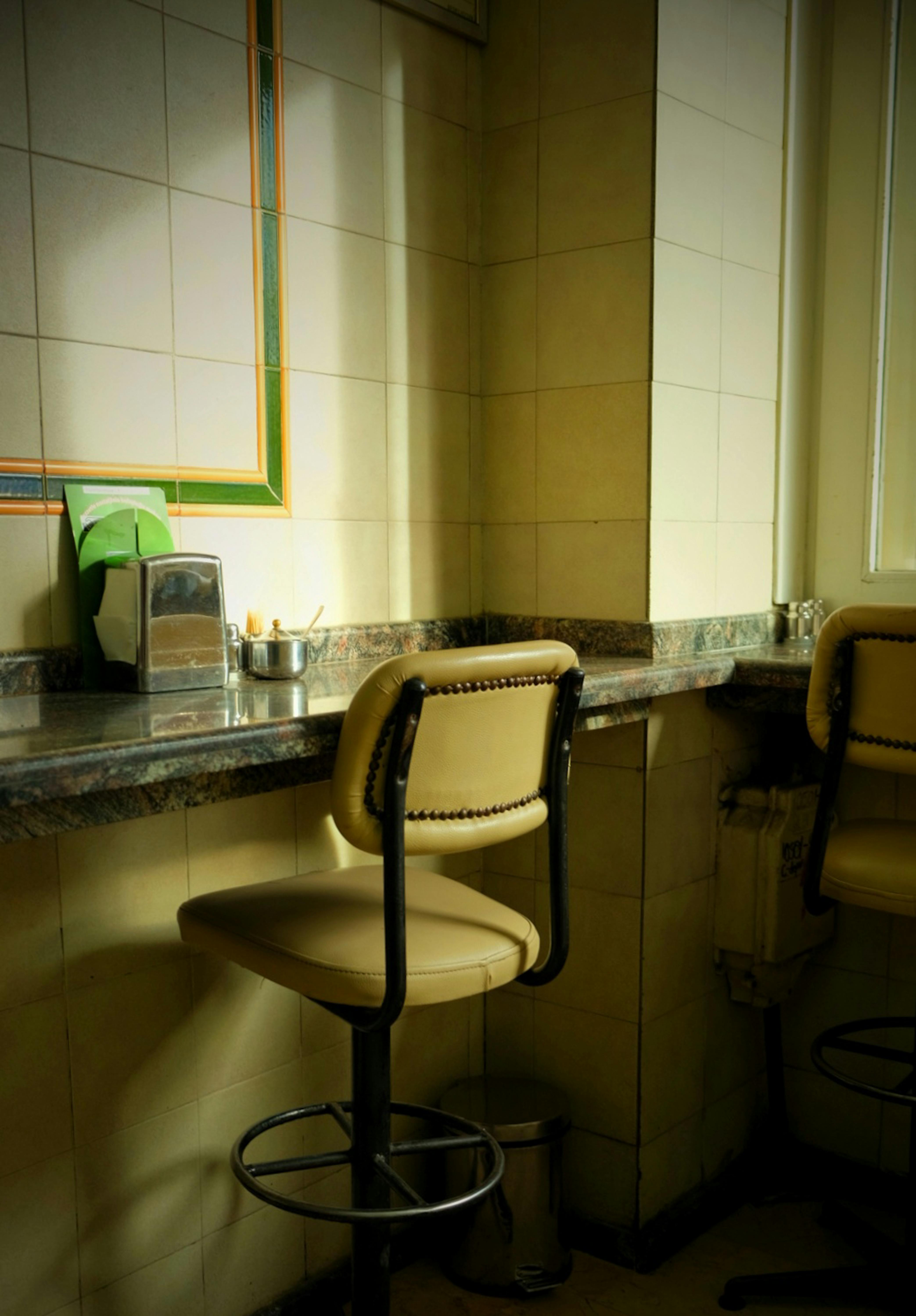 Bar Stool by a Table in a Buffet · Free Stock Photo