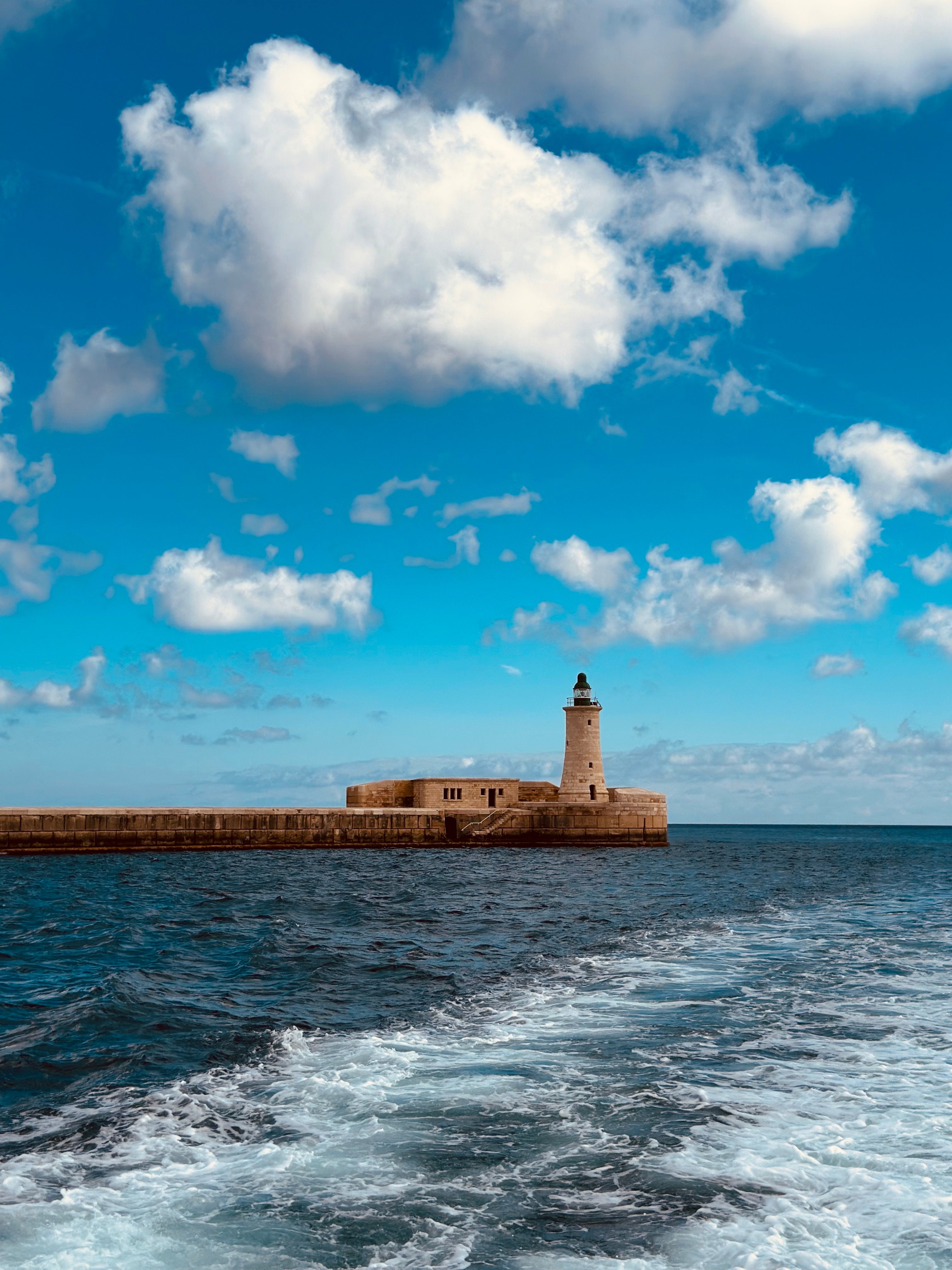 Lighthouse on Sea Coast · Free Stock Photo