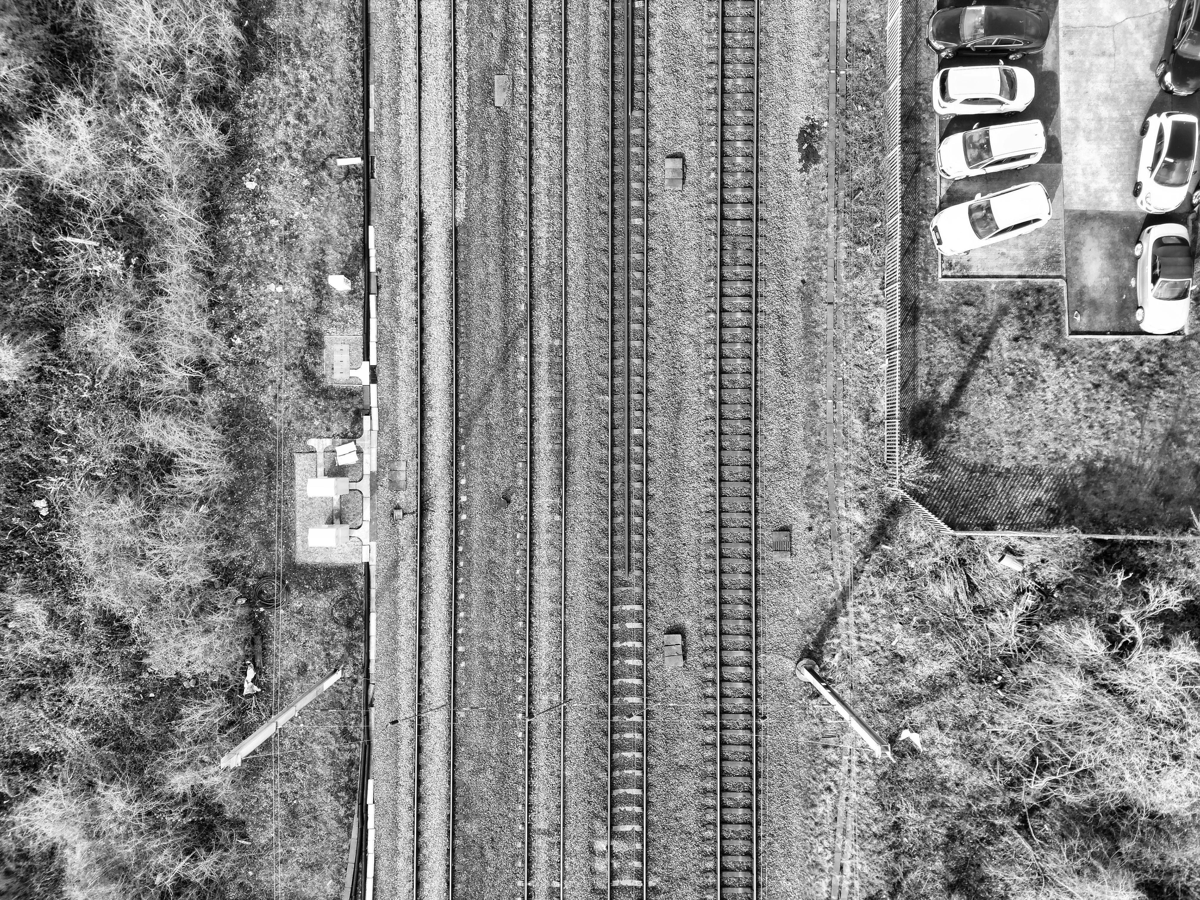 Black and White Photography of Train Rails · Free Stock Photo