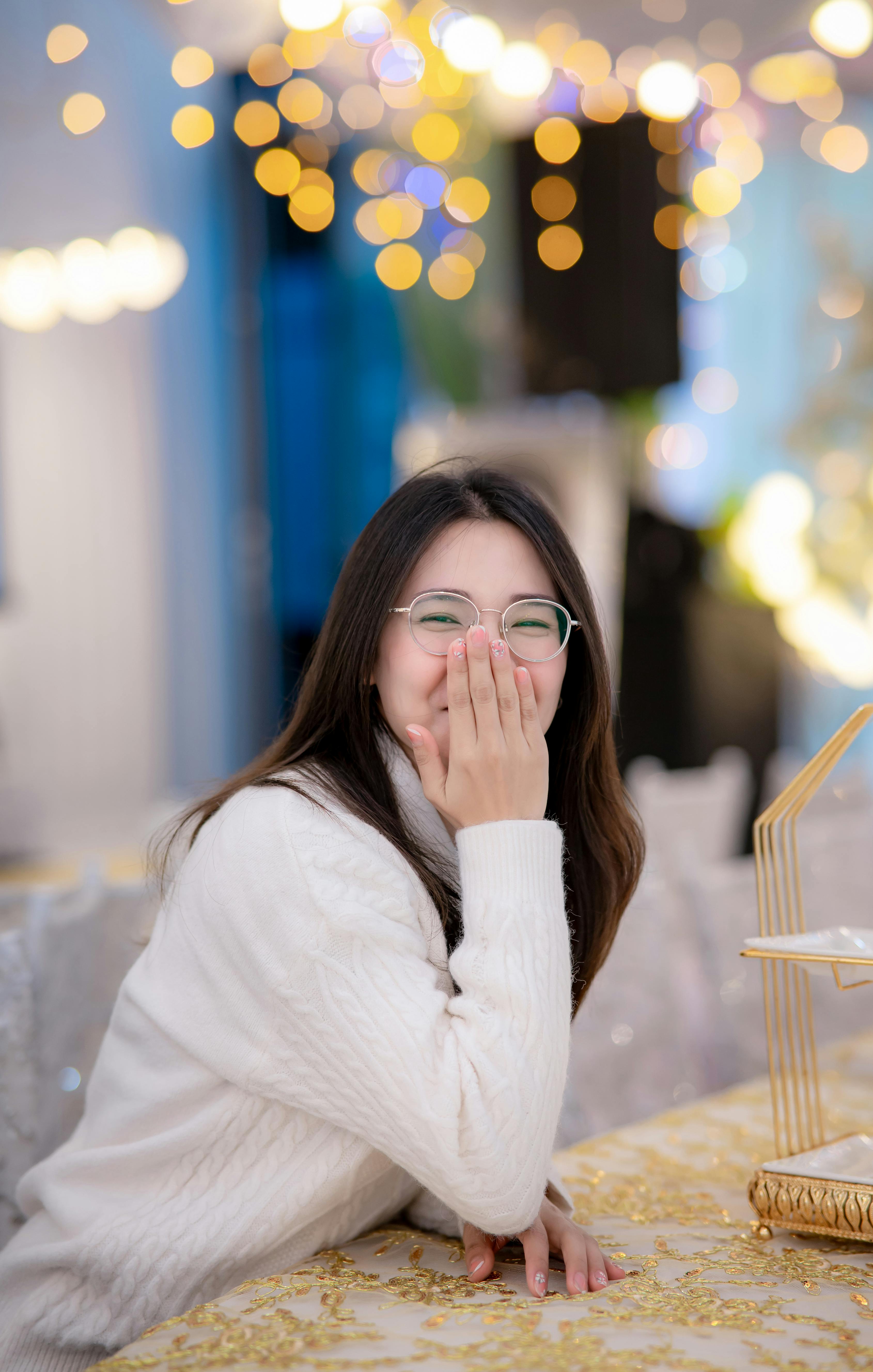 Woman Covering Smile with Her Hand · Free Stock Photo