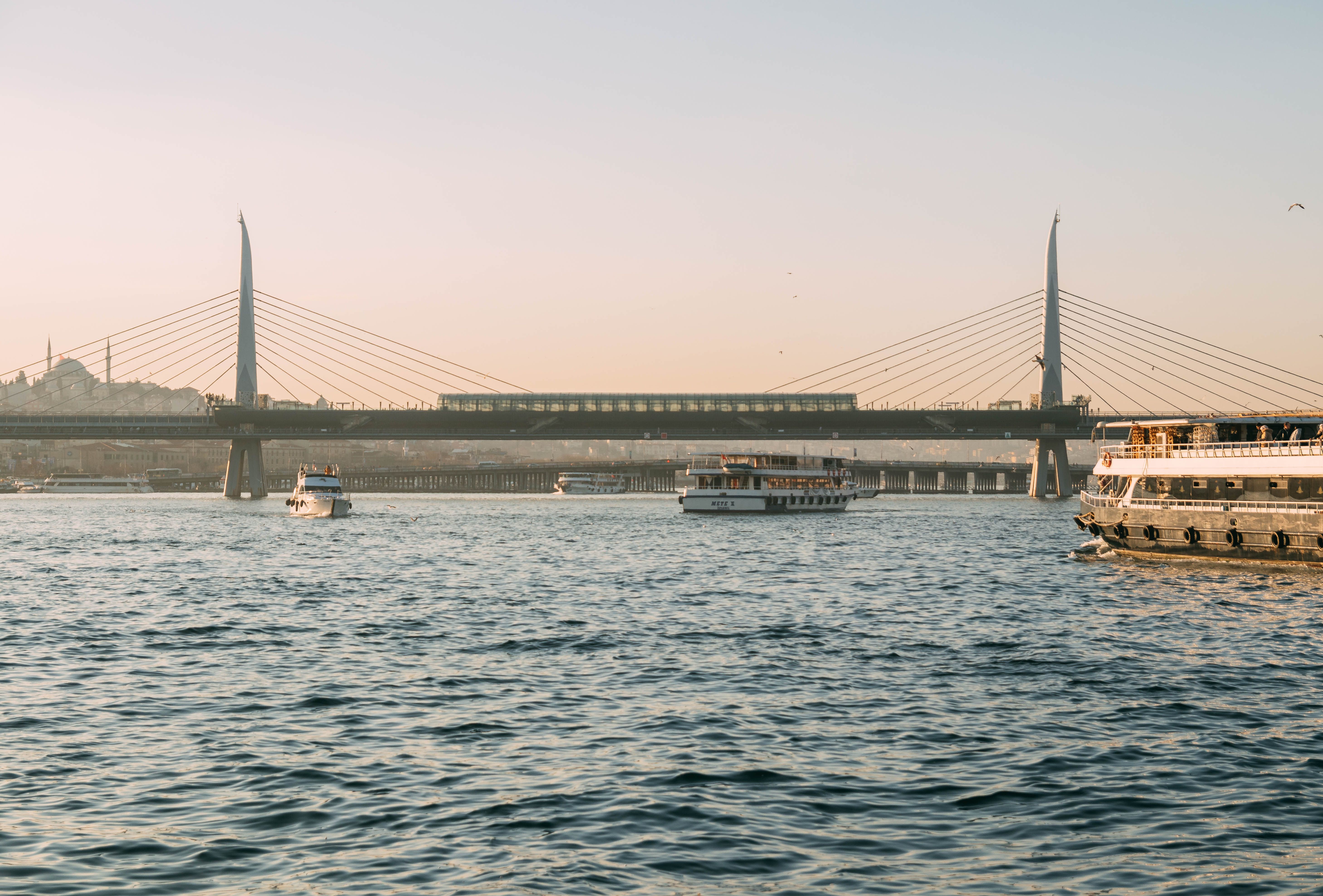 Golden Horn Bridge with Boats on Bosphorus at Sunset · Free Stock Photo