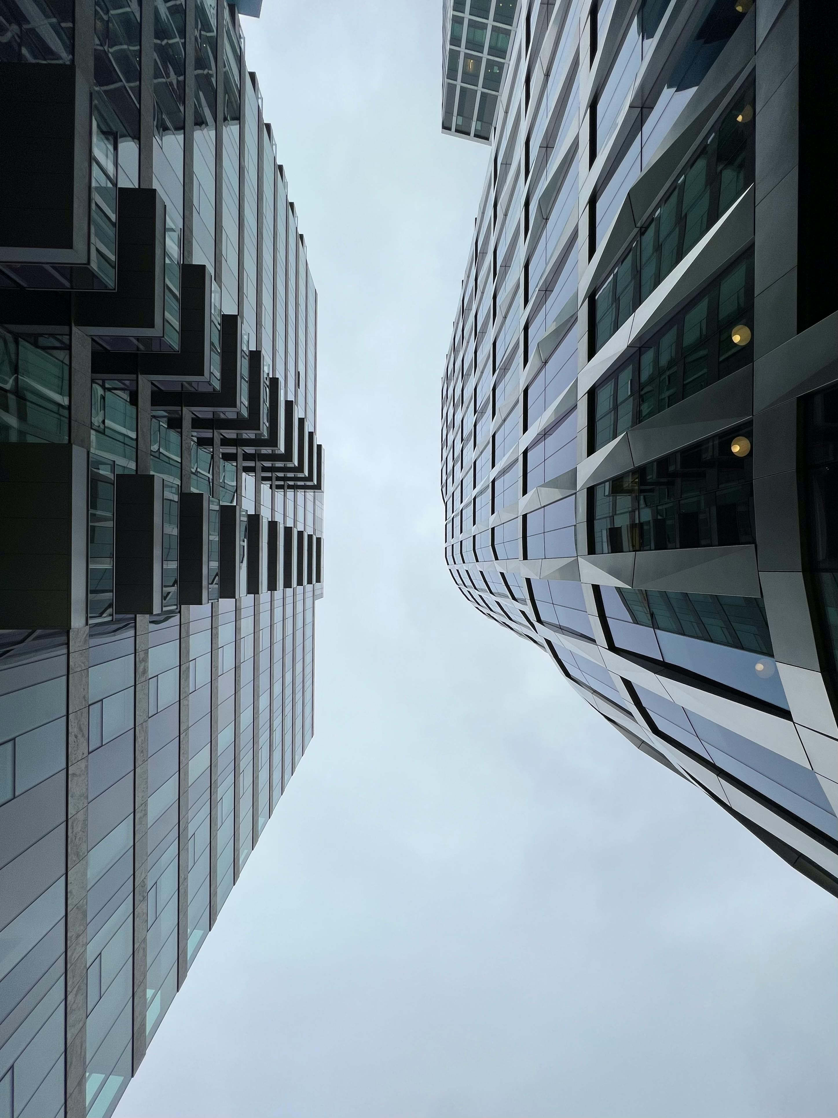 A view of tall buildings from below · Free Stock Photo