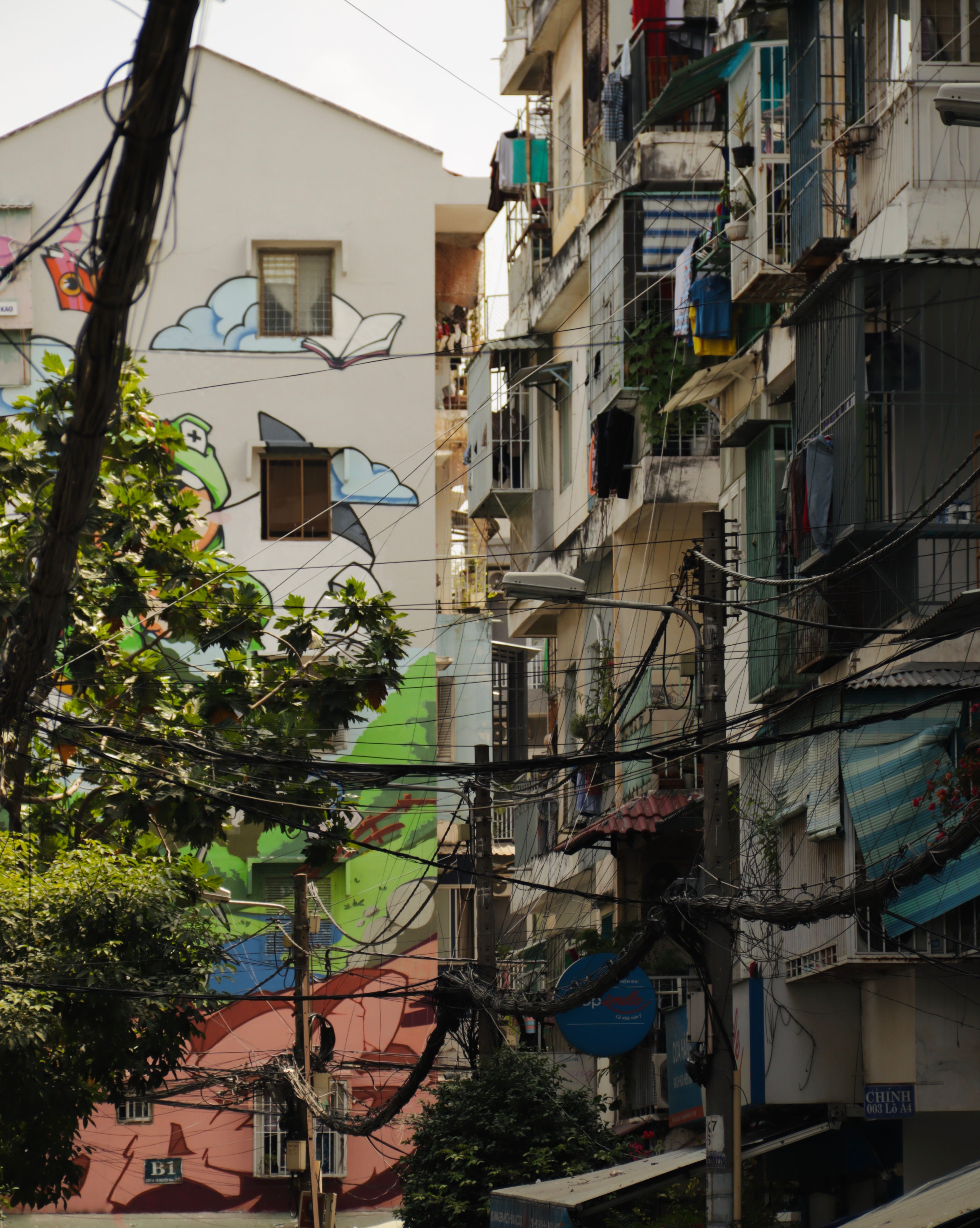 Apartment Building with a Mural and Balconies with Drying Laundry ...