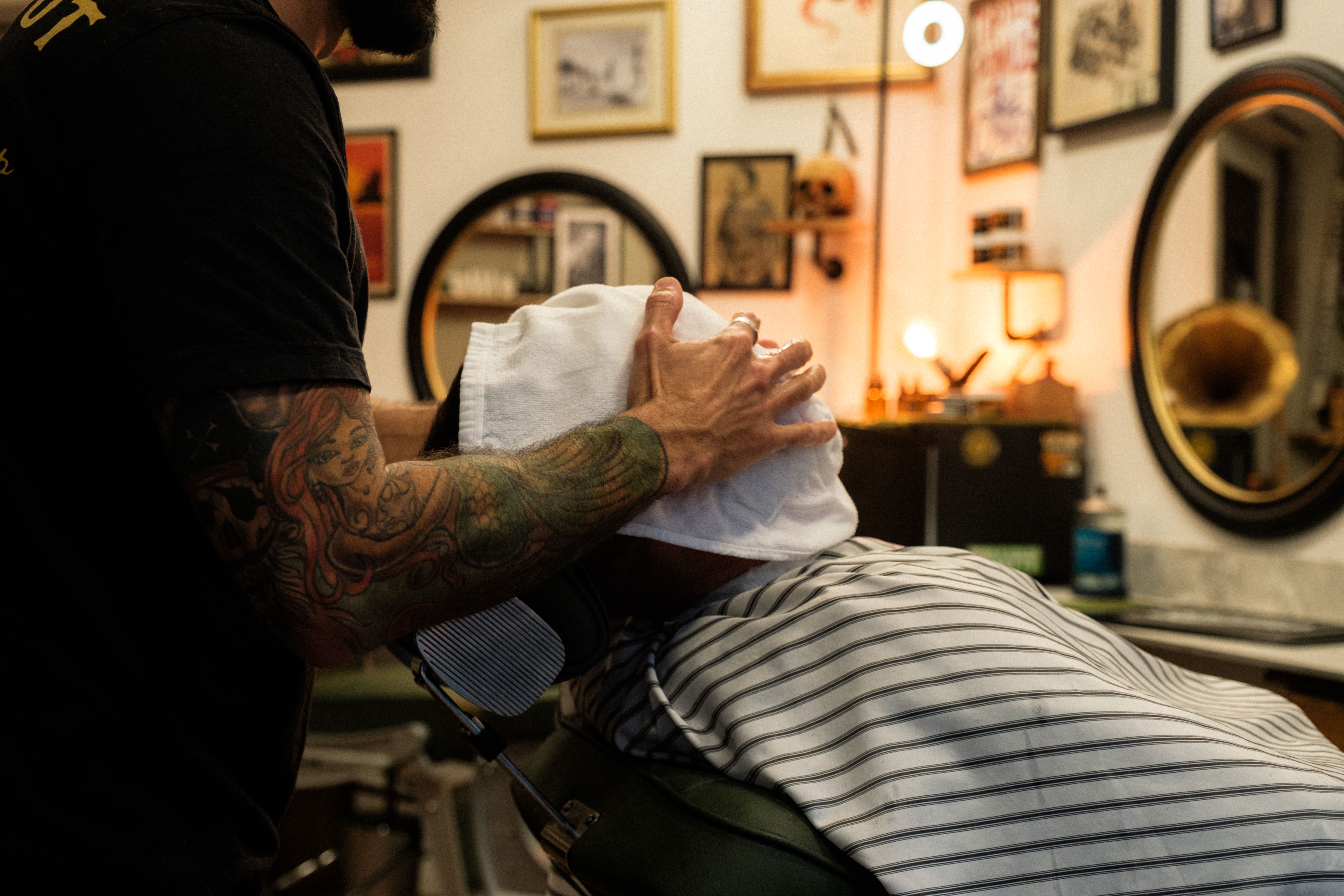 Barber Putting a Towel on the Customers Face · Free Stock Photo