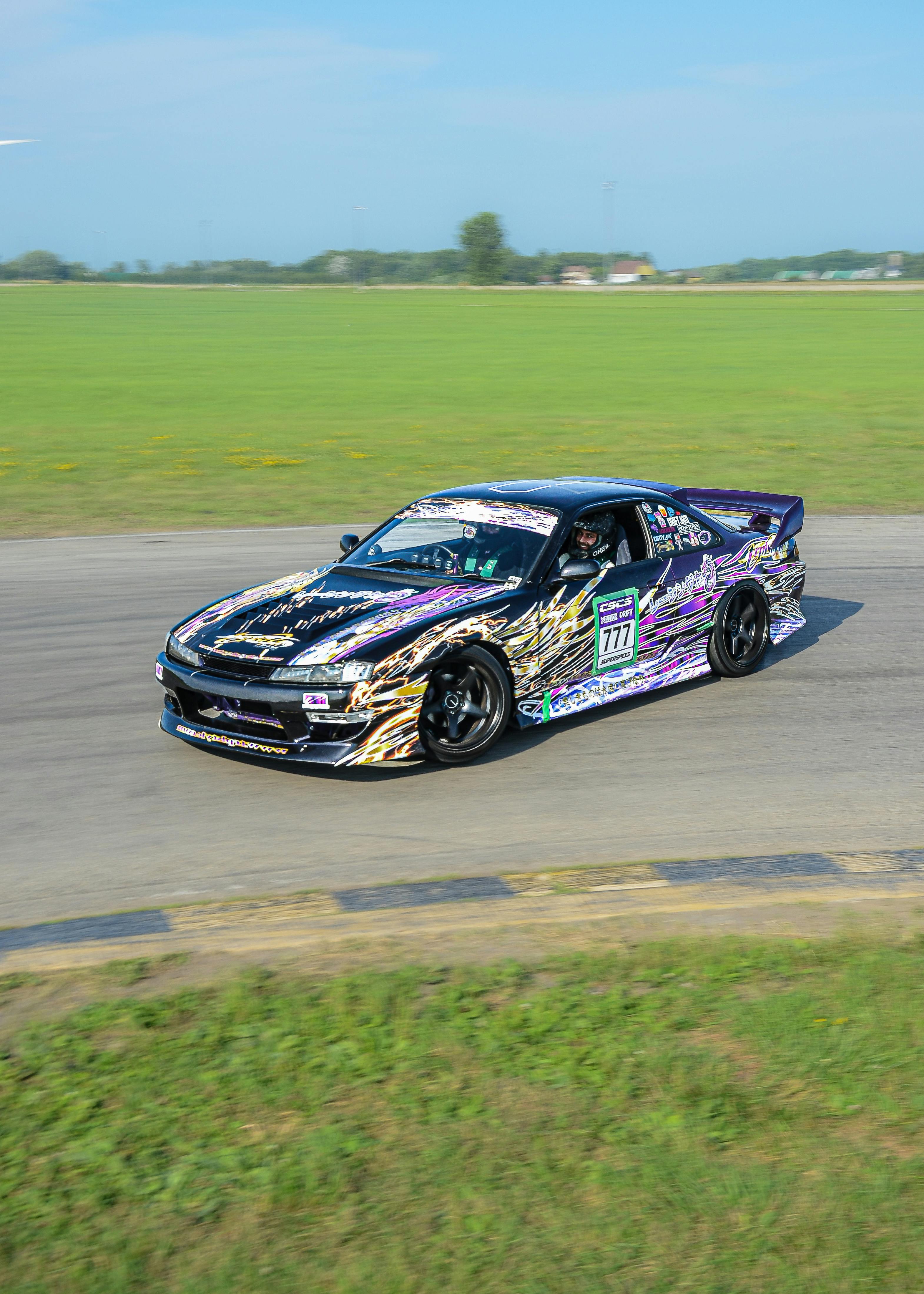 A Modified Nissan Silvia S14 Drift Car on a Track · Free Stock Photo