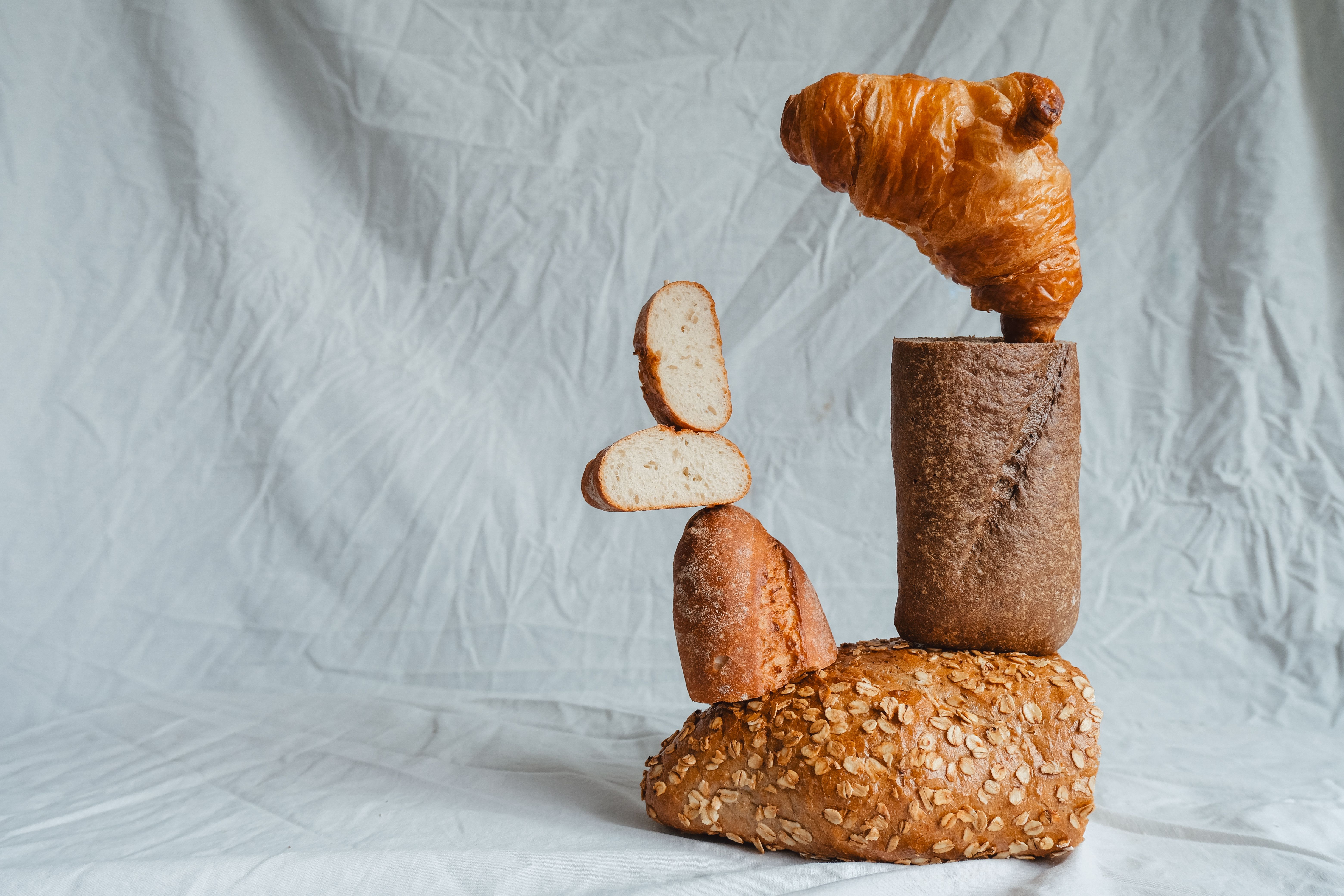A Sculpture Of Bread And Bread On Top Of A Table Free Stock Photo