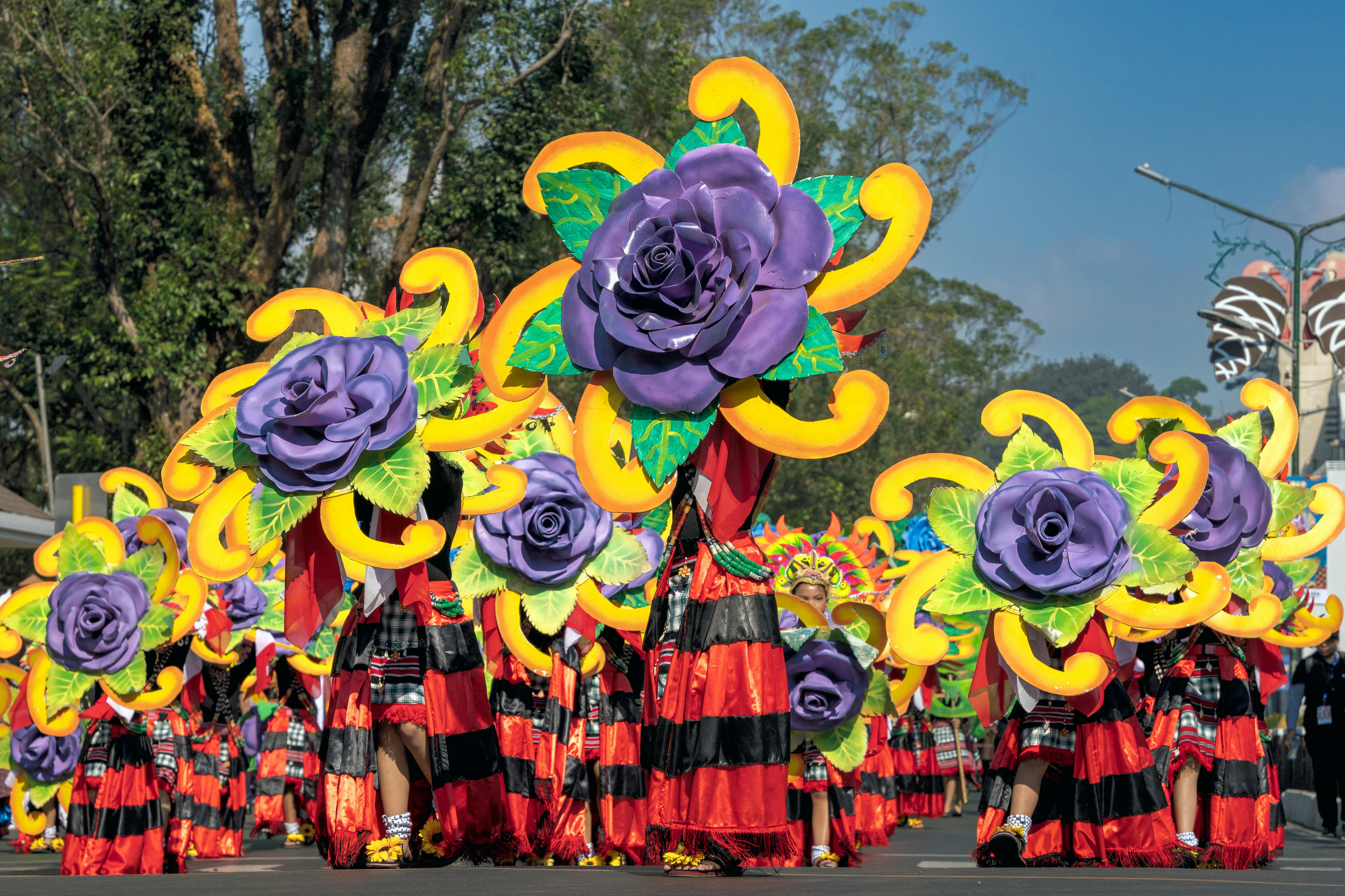 People in Costumes Dancing on a Street at a Parade · Free Stock Photo