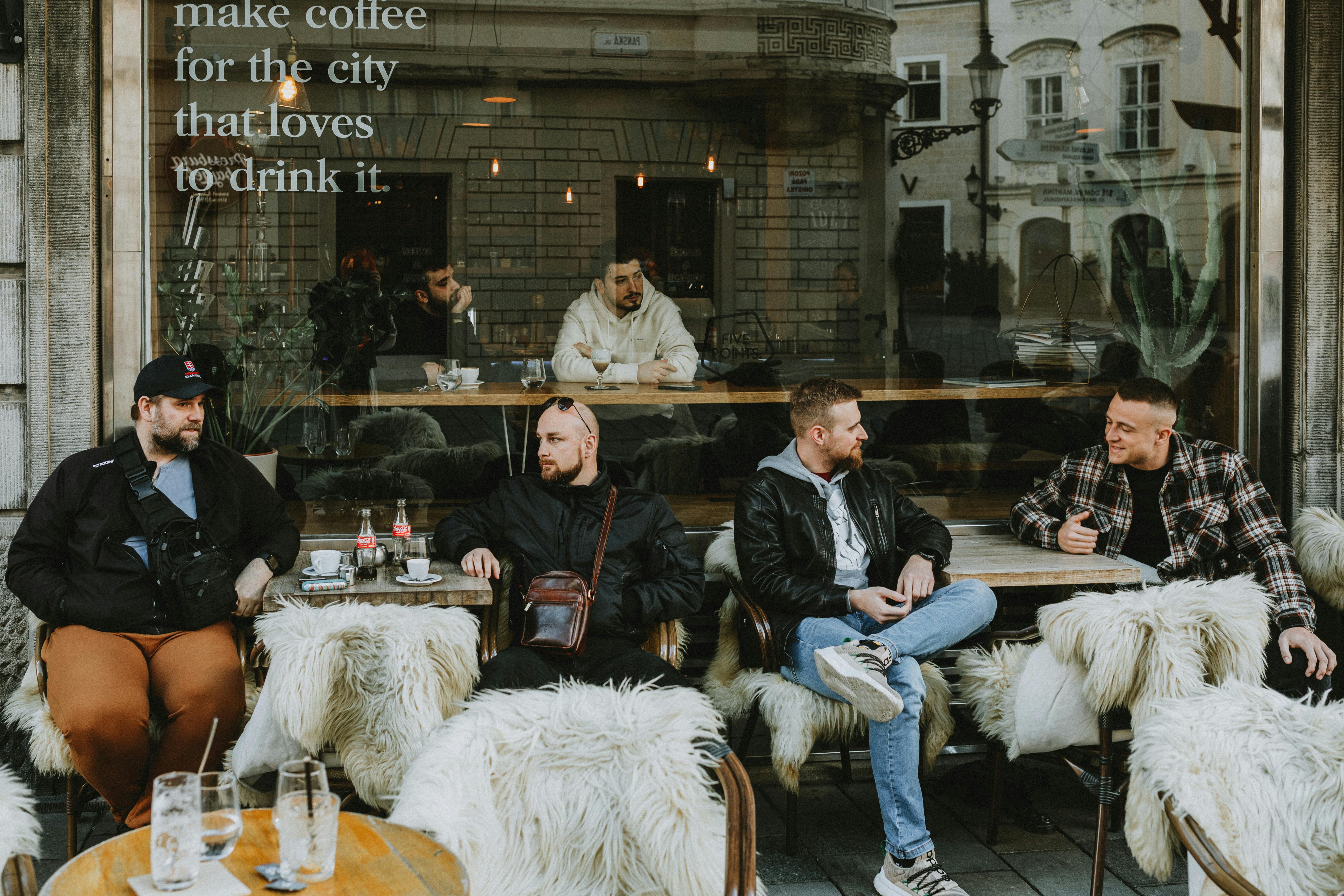 Group Of Men Outside A Coffee Shop · Free Stock Photo
