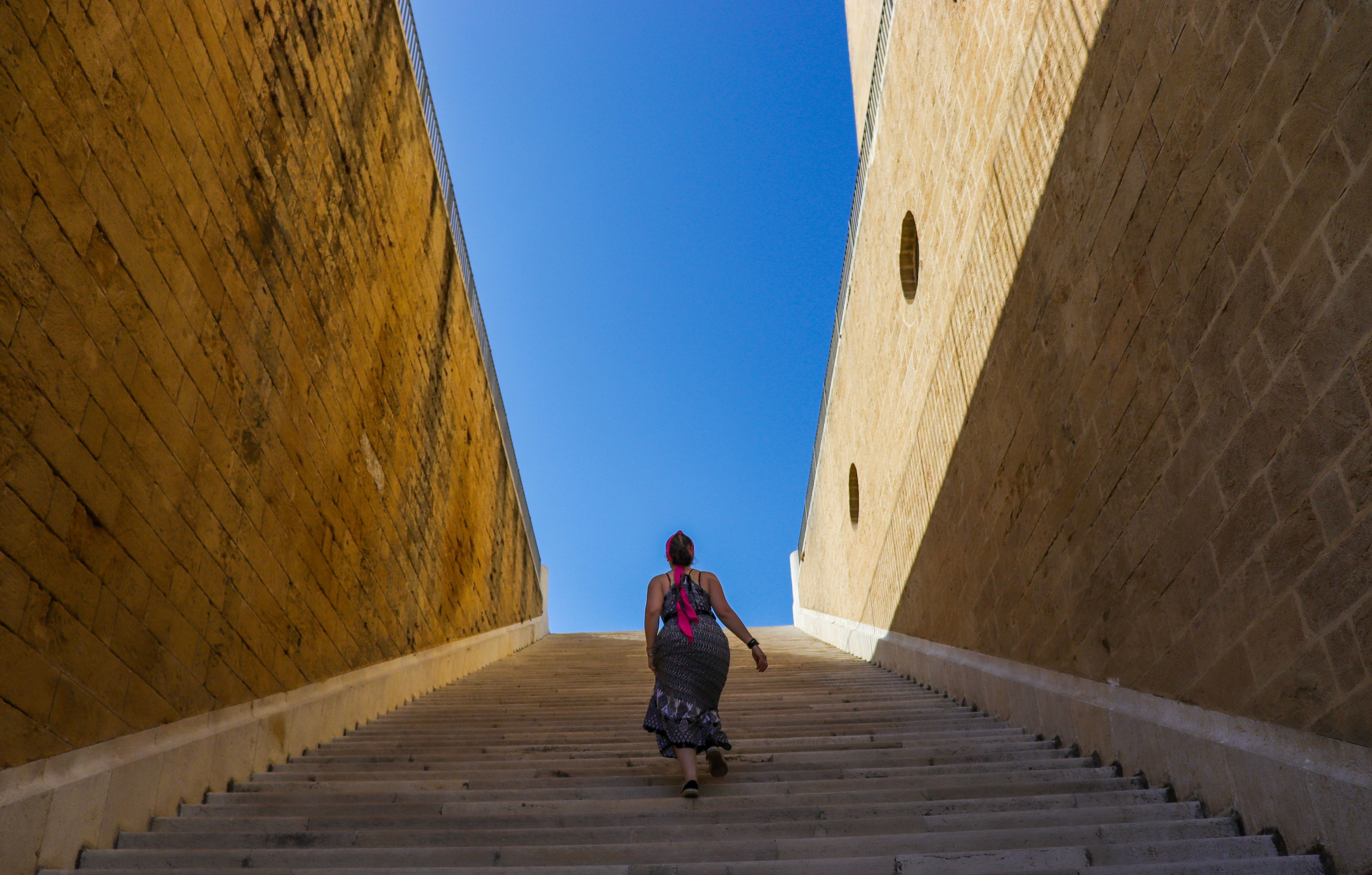 Woman Walking Up Stairs · Free Stock Photo