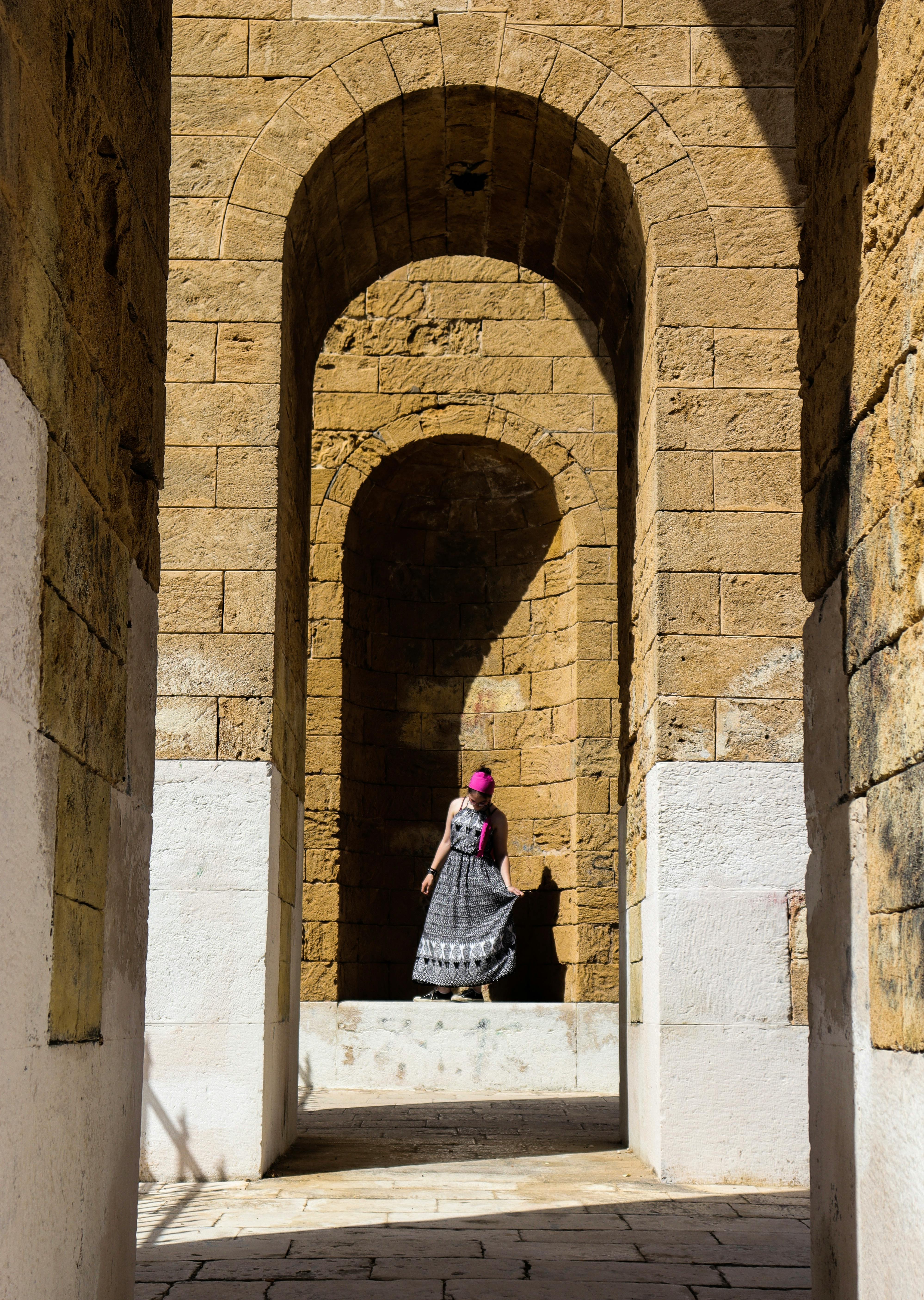 Woman in Arch Niche · Free Stock Photo