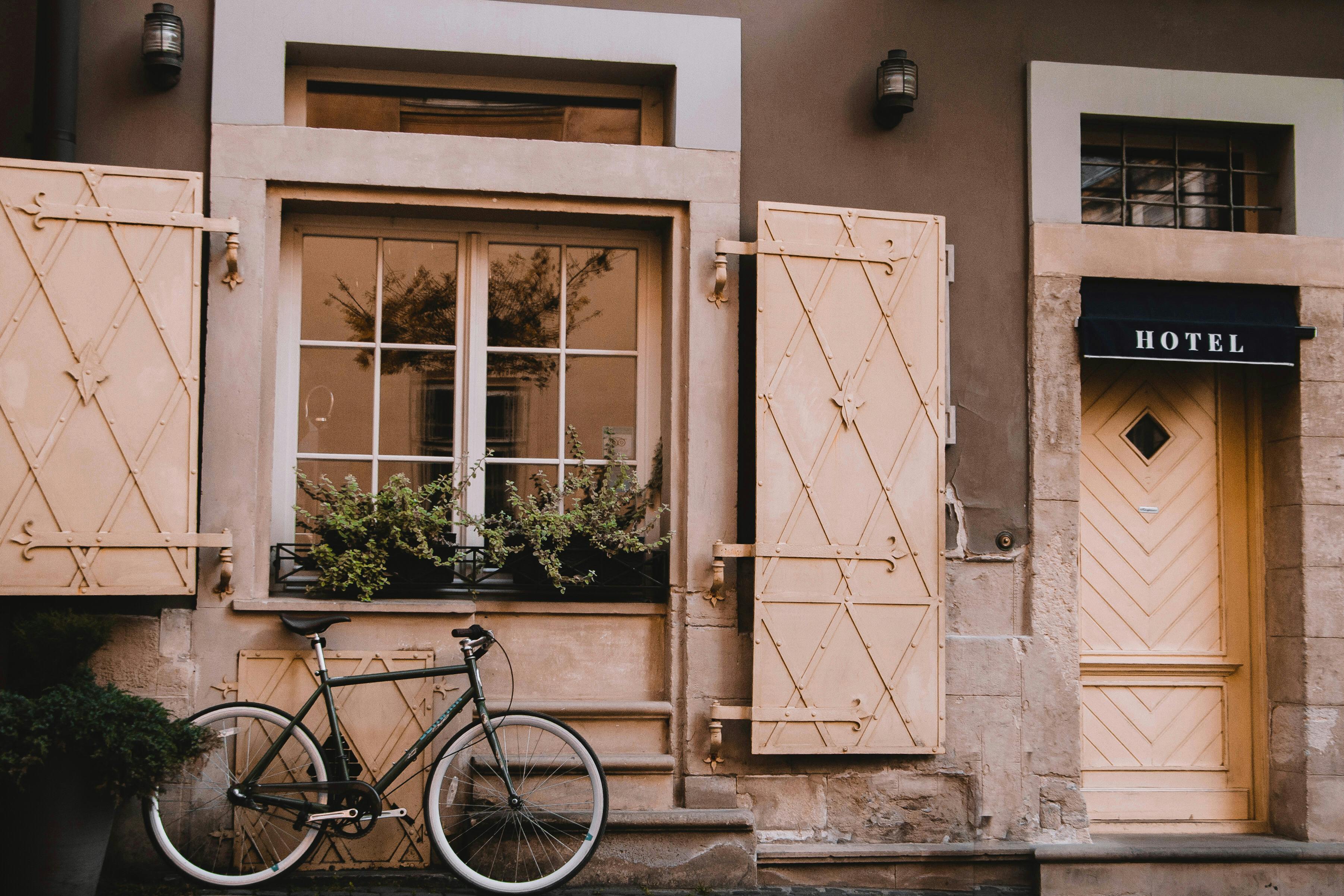 Bike under Window of Hotel · Free Stock Photo