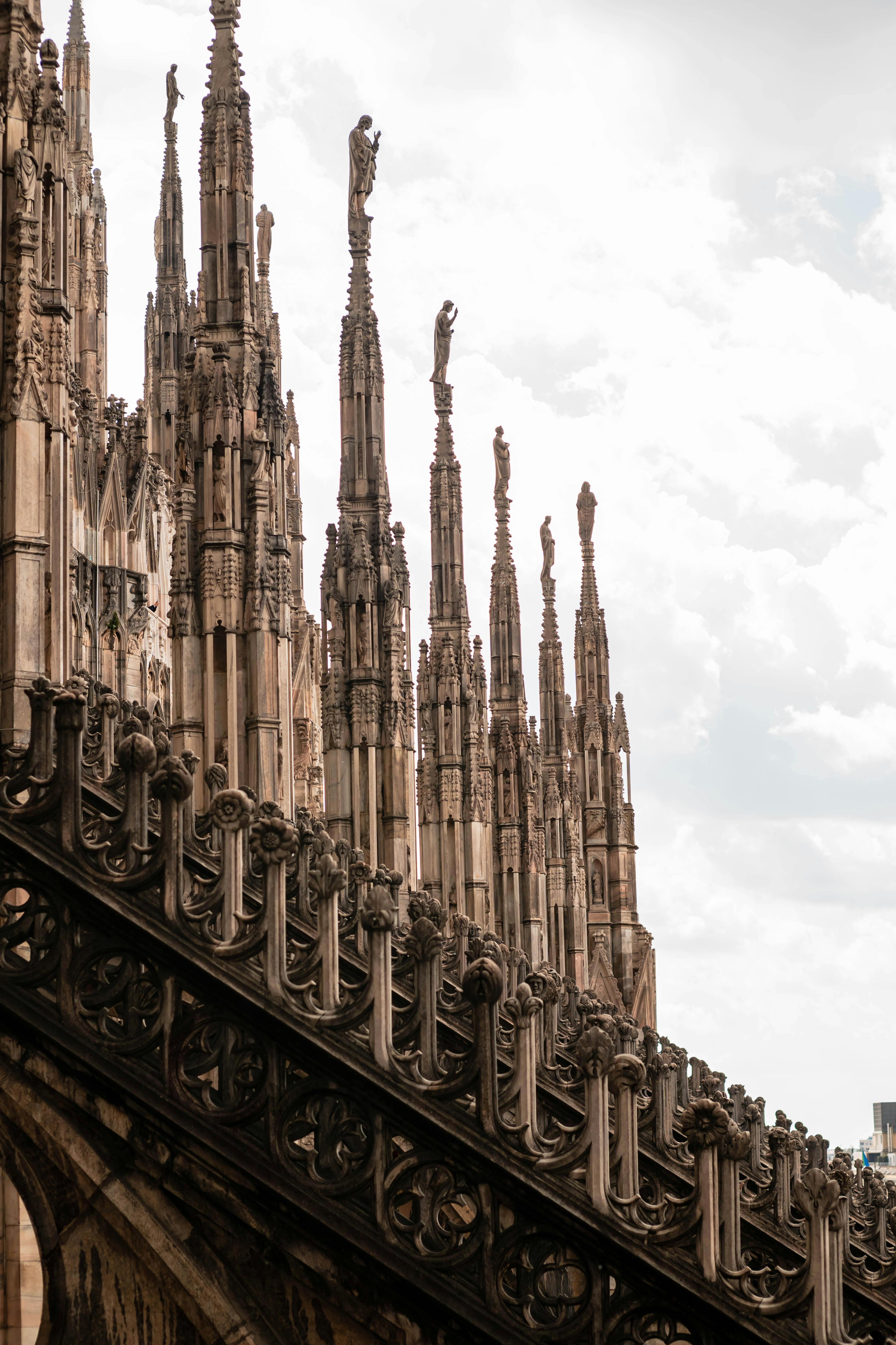Part of Milan Cathedral exterior on dark evening · Free Stock Photo