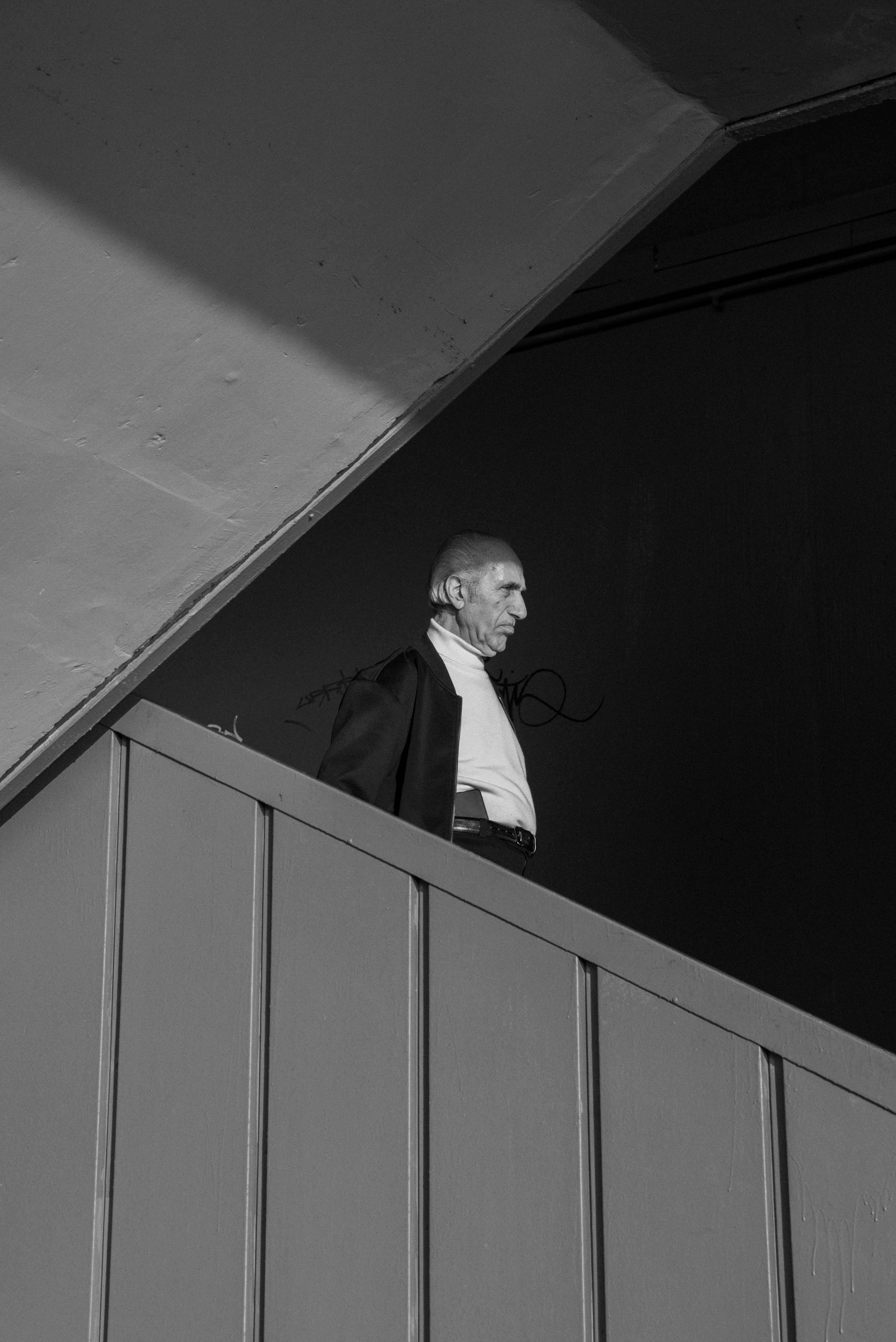 Man over Wall in Black and White · Free Stock Photo