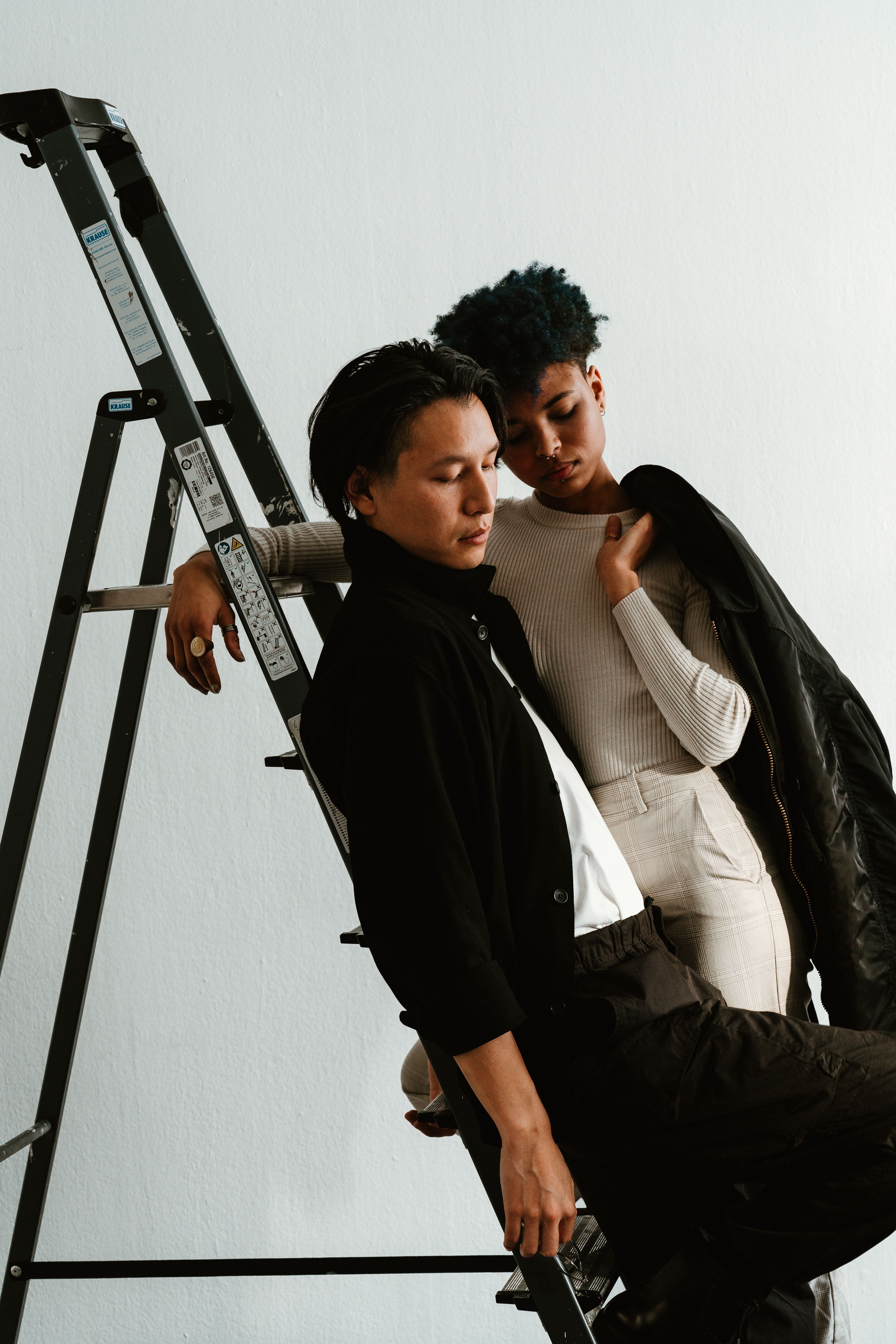 Woman and Man Leaning on Ladder · Free Stock Photo