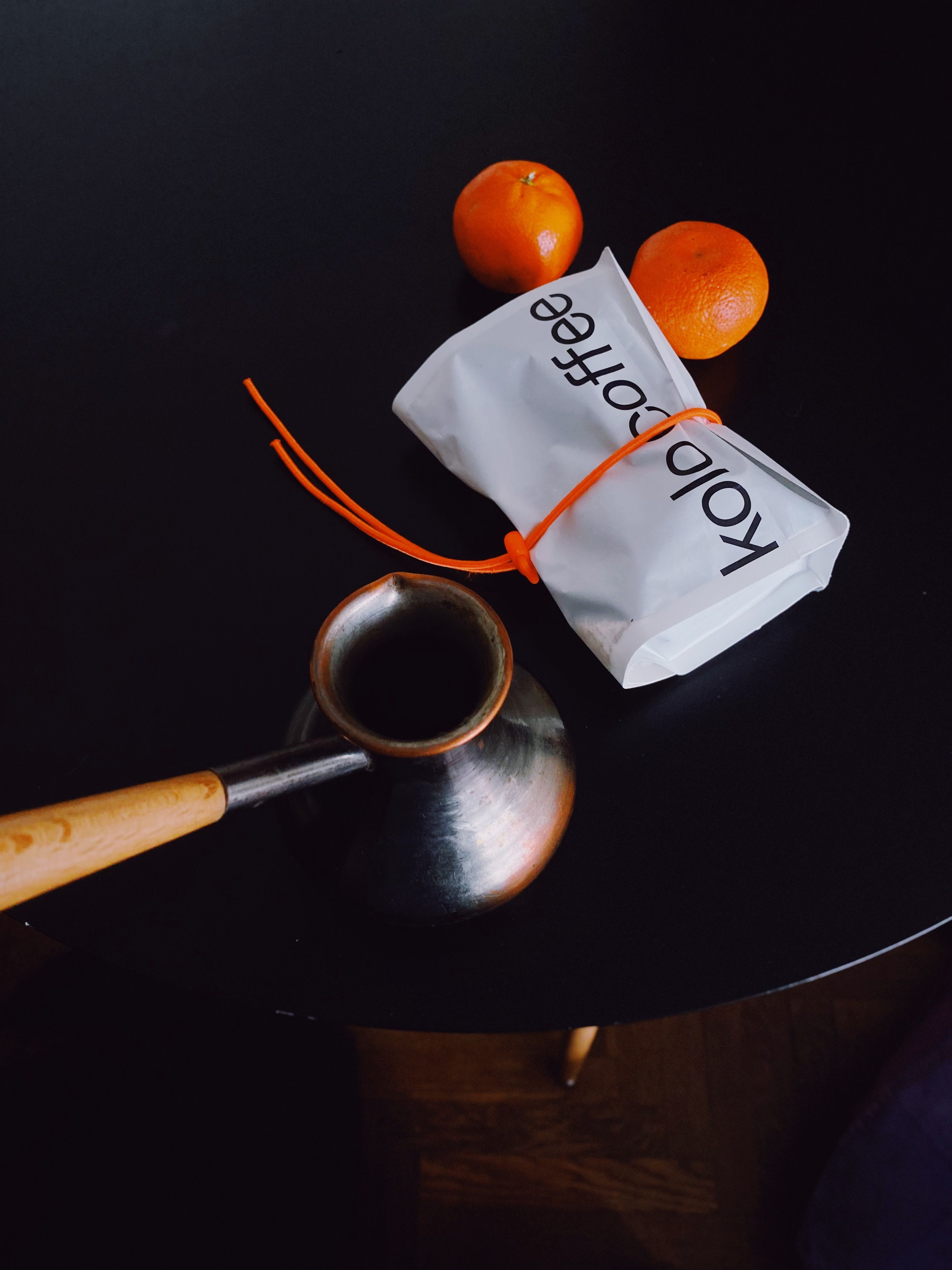 Tangerines, Package and Pot on Table · Free Stock Photo