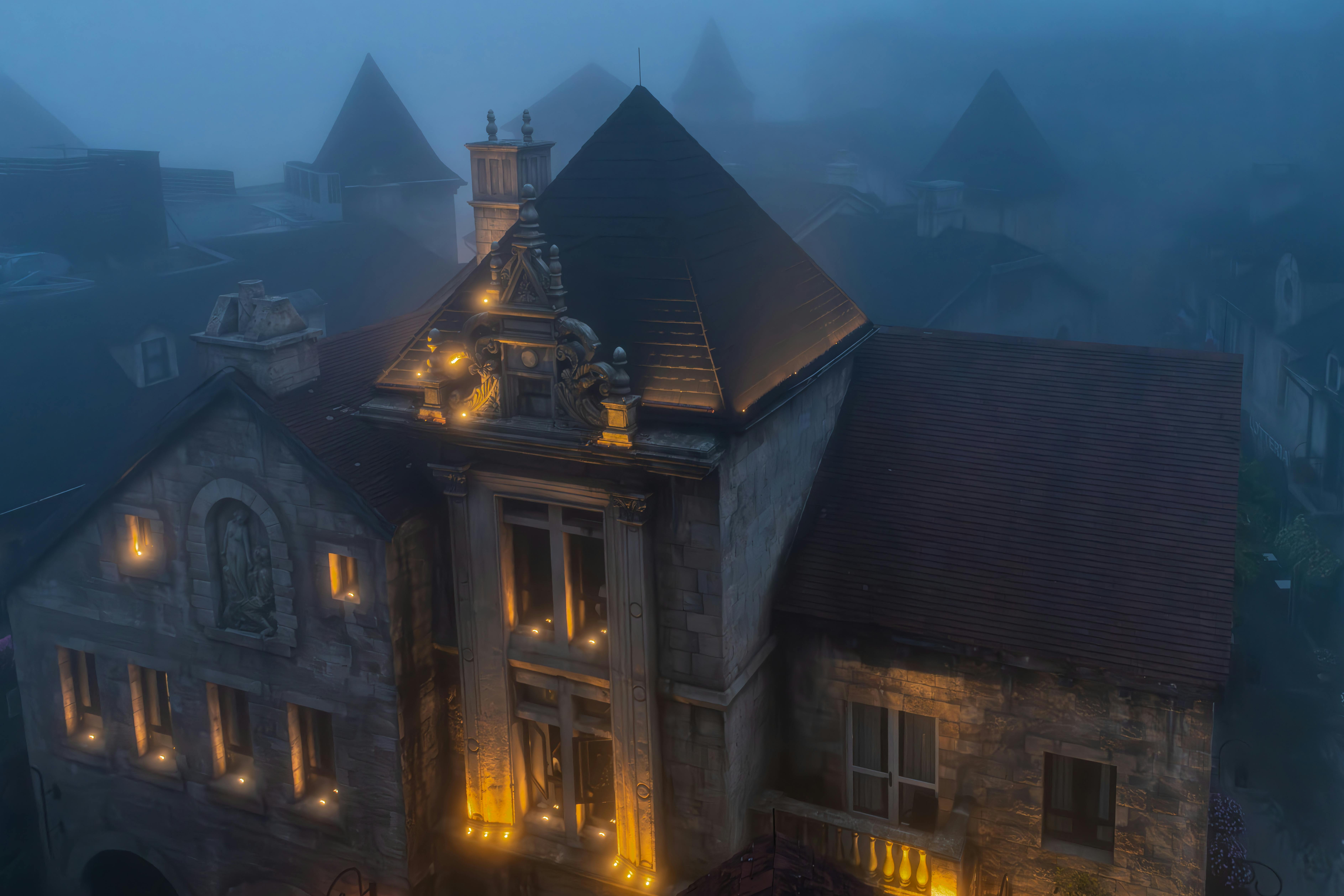 Illuminated Historical Building in Fog at Dusk · Free Stock Photo