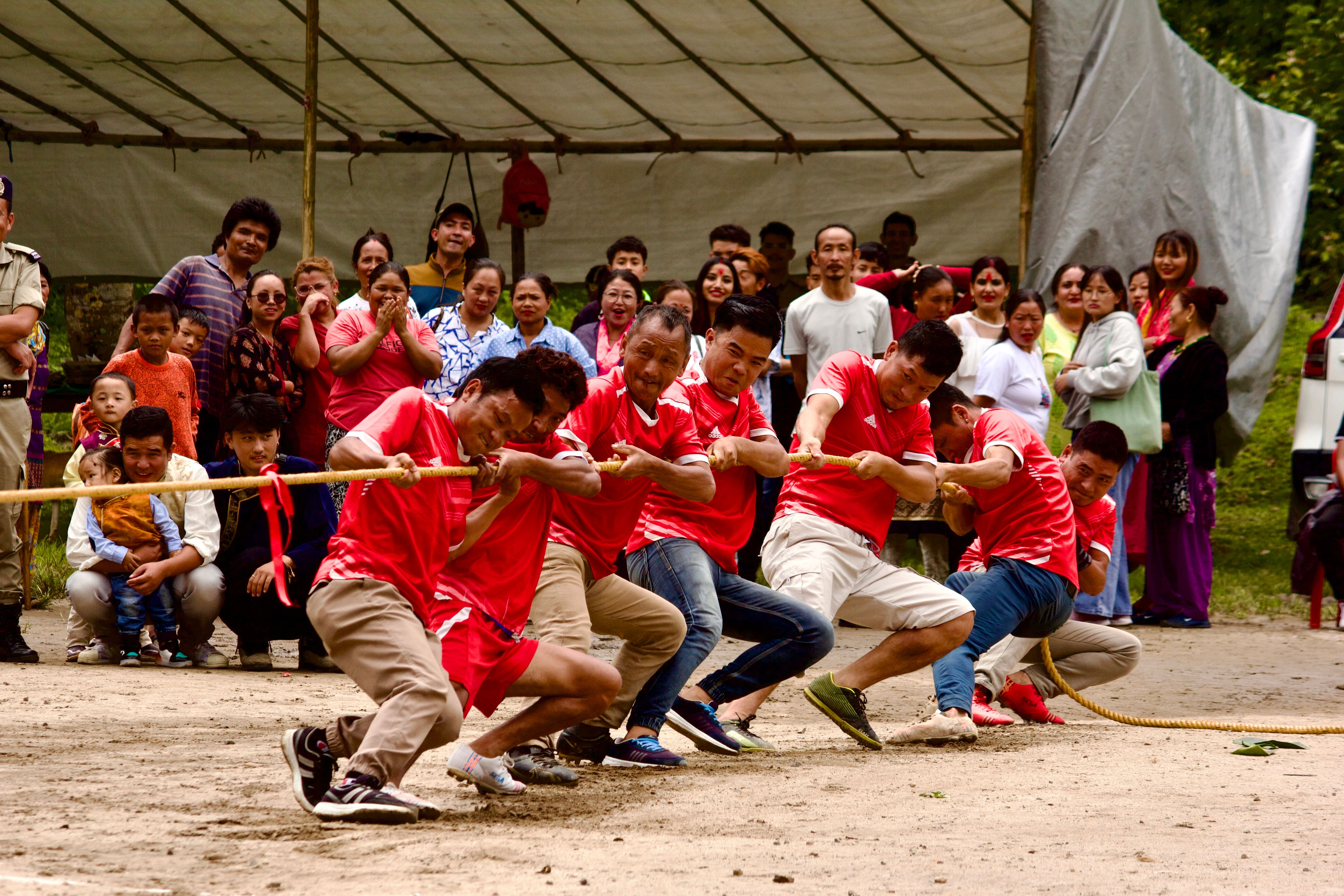 Men Playing Tug of War with Audience Cheering them · Free Stock Photo