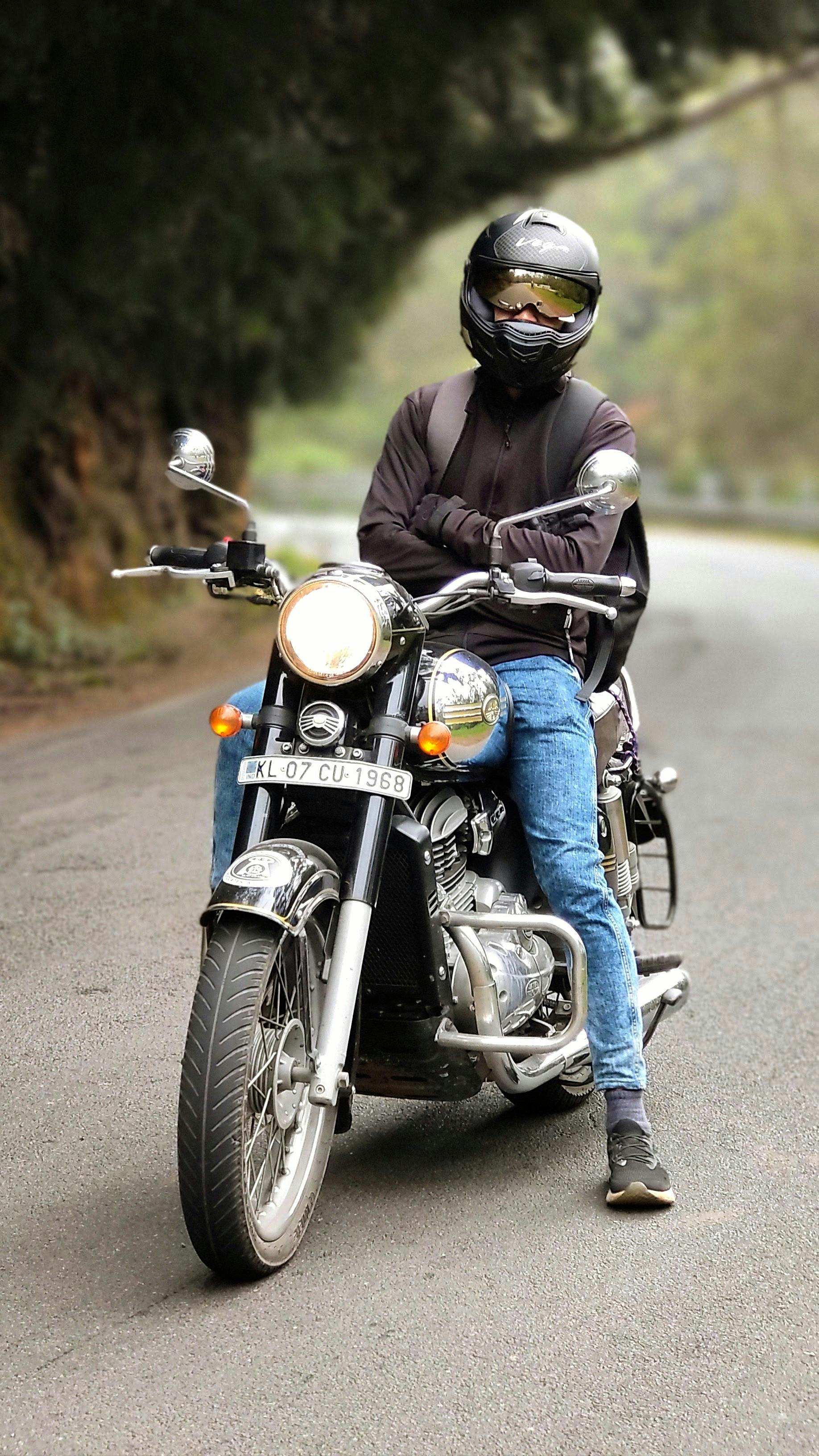 Man Sitting on Motorbike on Road · Free Stock Photo