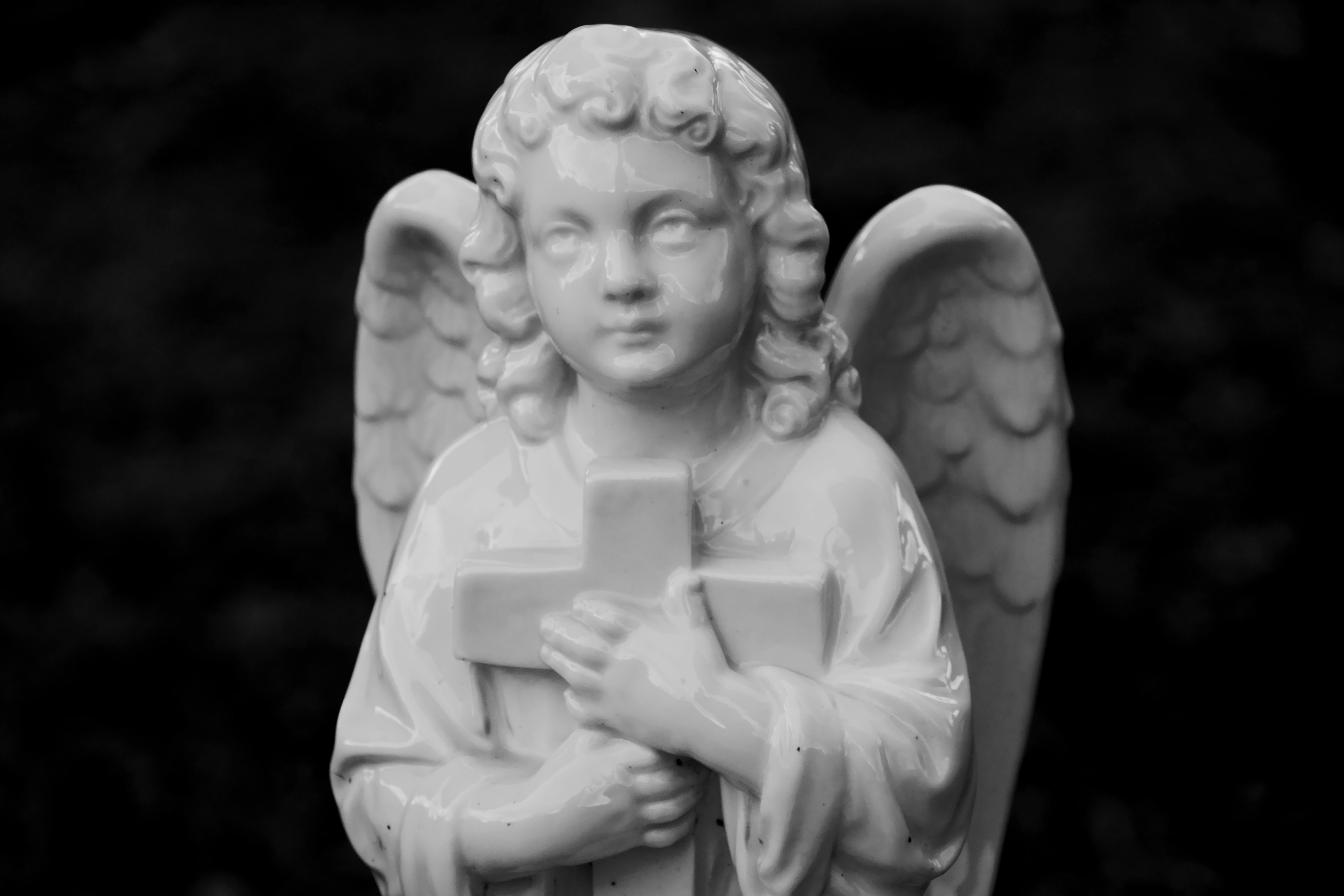 Statue of Baby Angel with Cross · Free Stock Photo