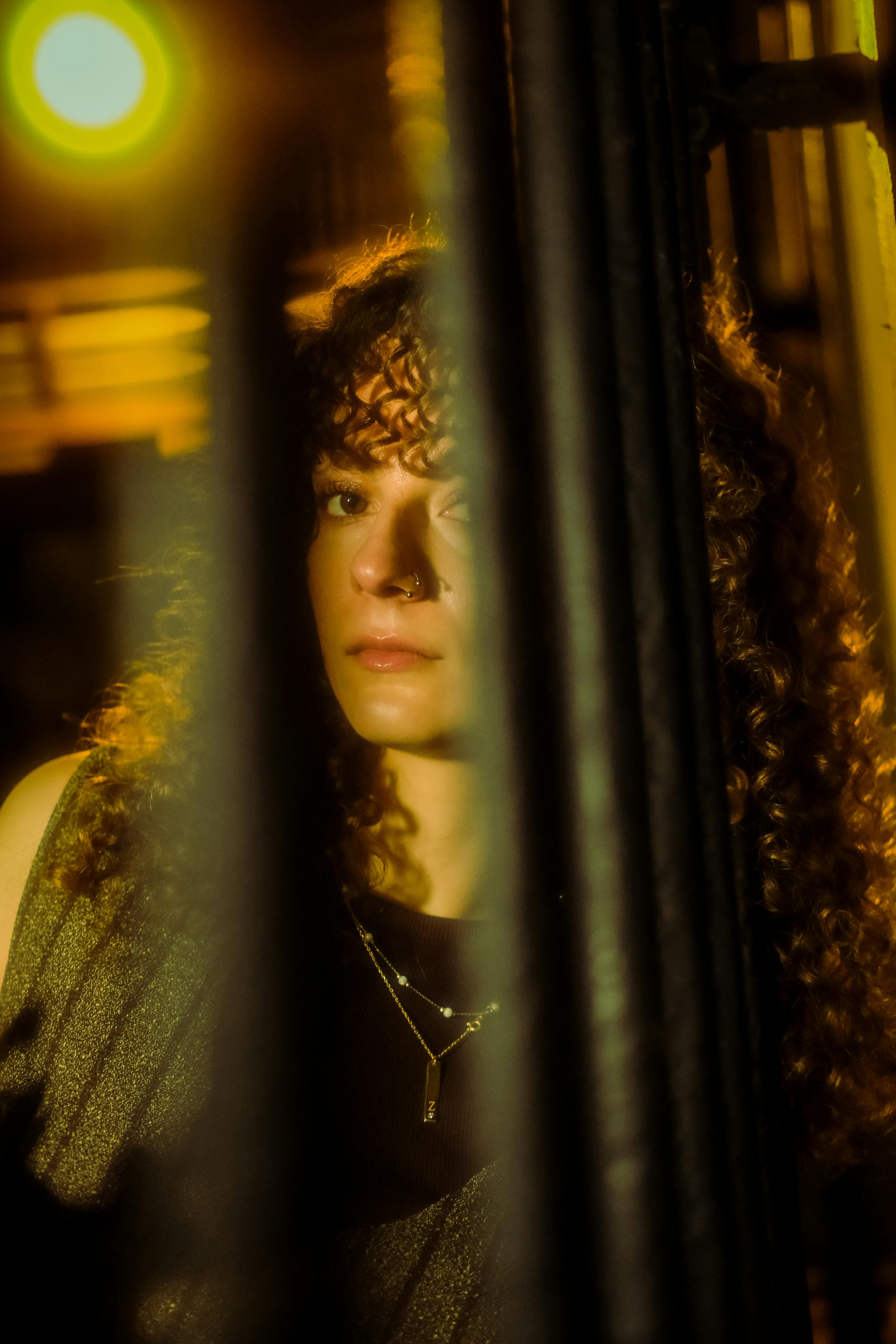 Woman Face behind Bars at Night · Free Stock Photo