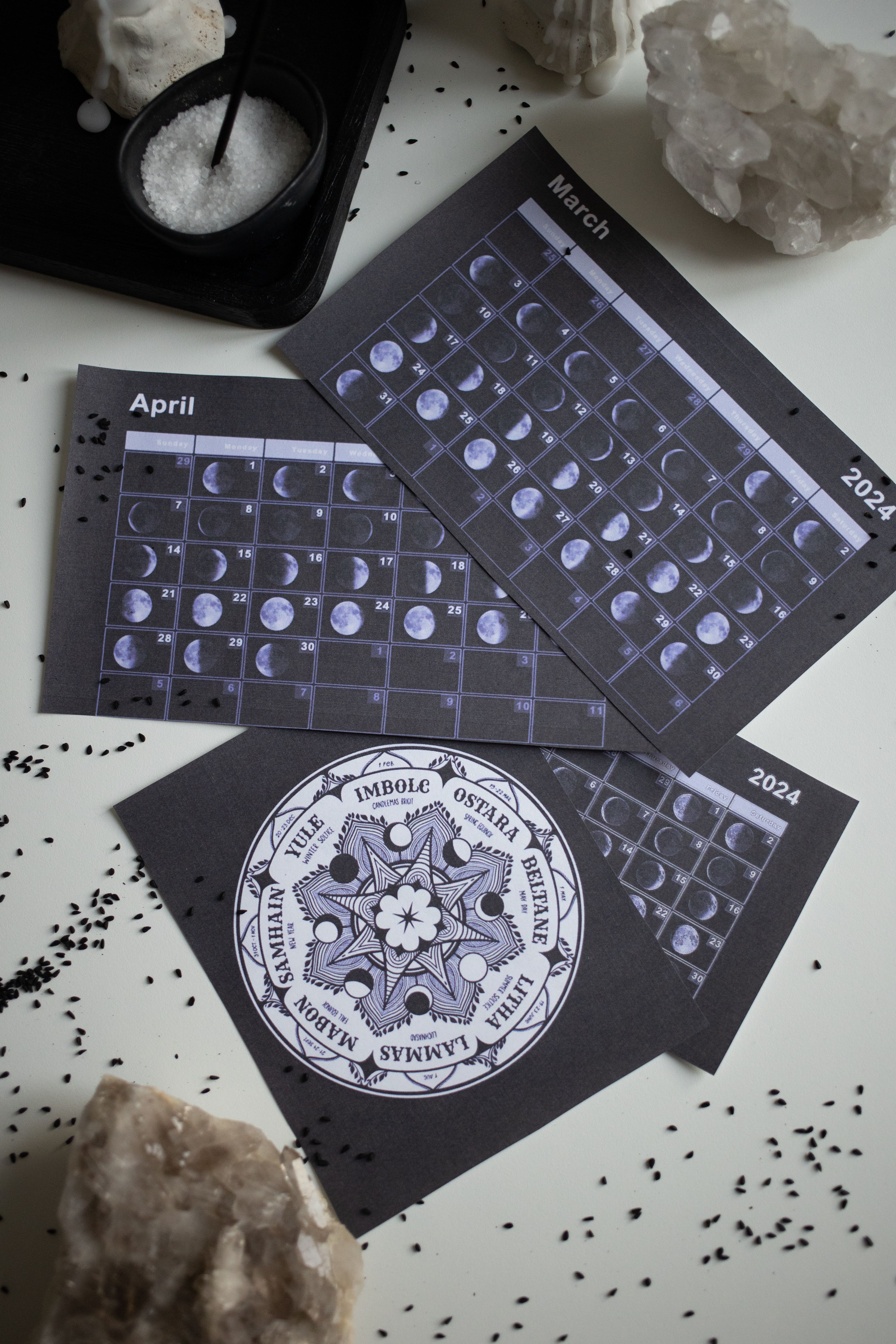 Wheel of Year and Black Calendar on Desk · Free Stock Photo
