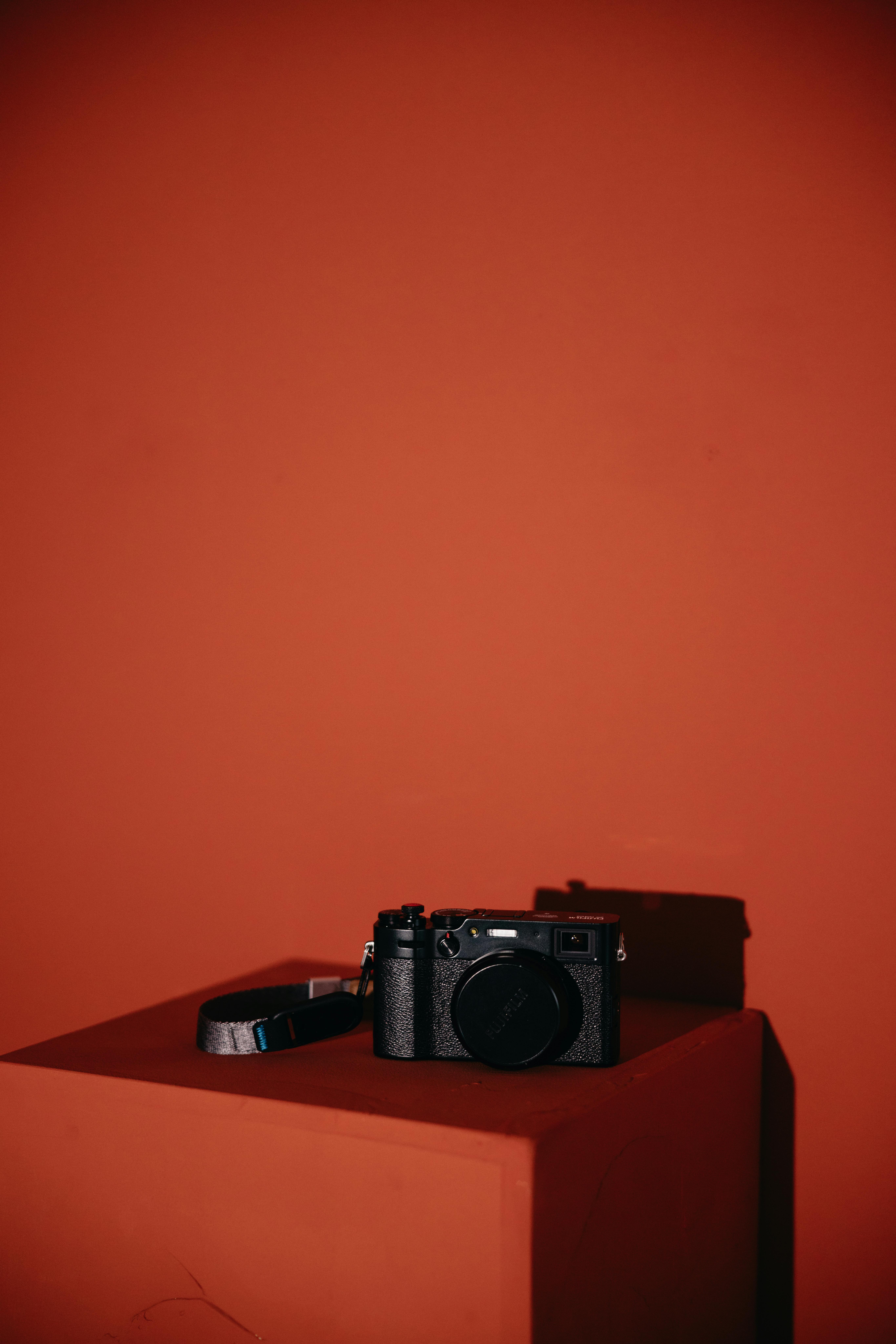 Camera in Red Background · Free Stock Photo