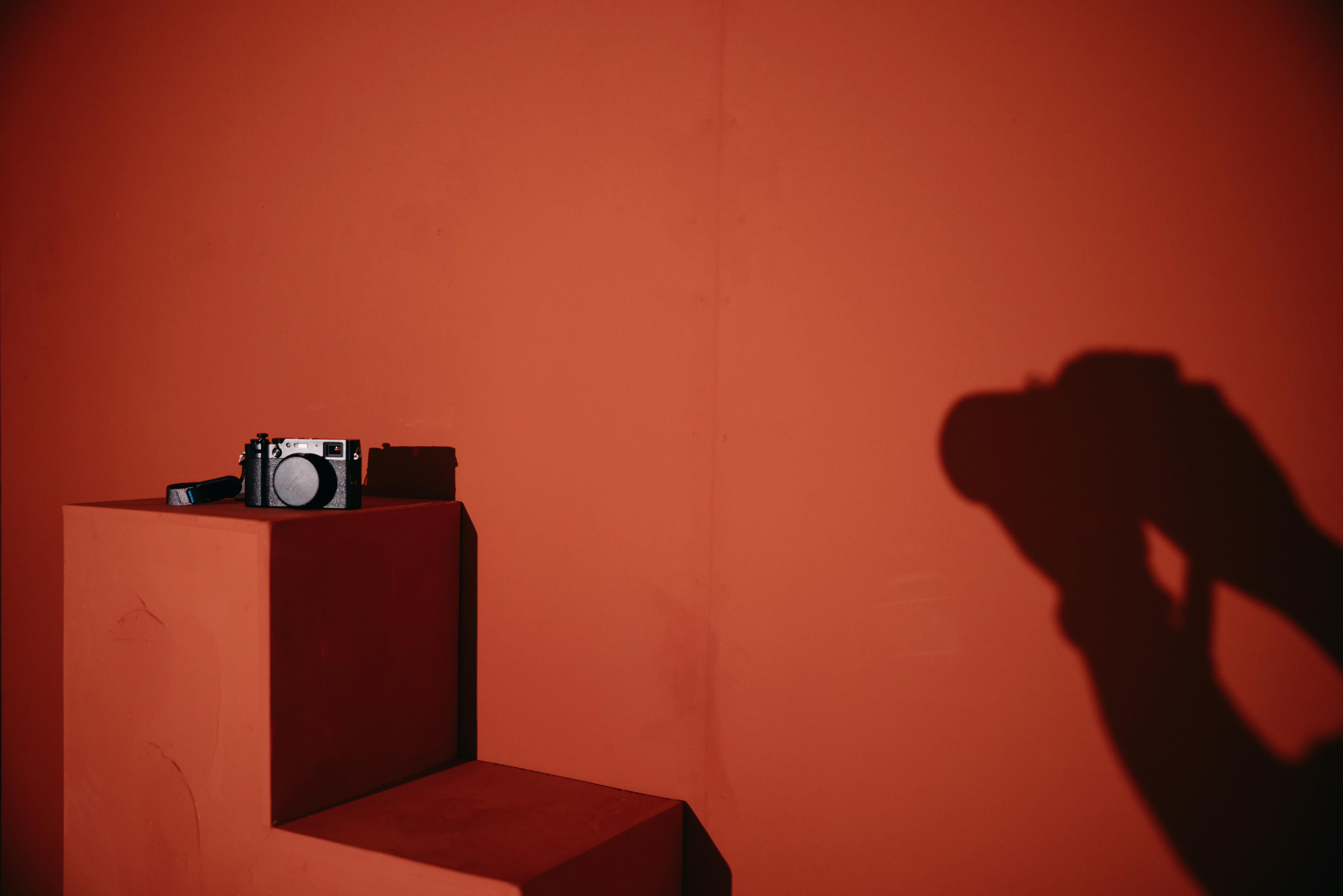 Shadow of Hands Holding Camera over Stairs with Camera · Free Stock Photo