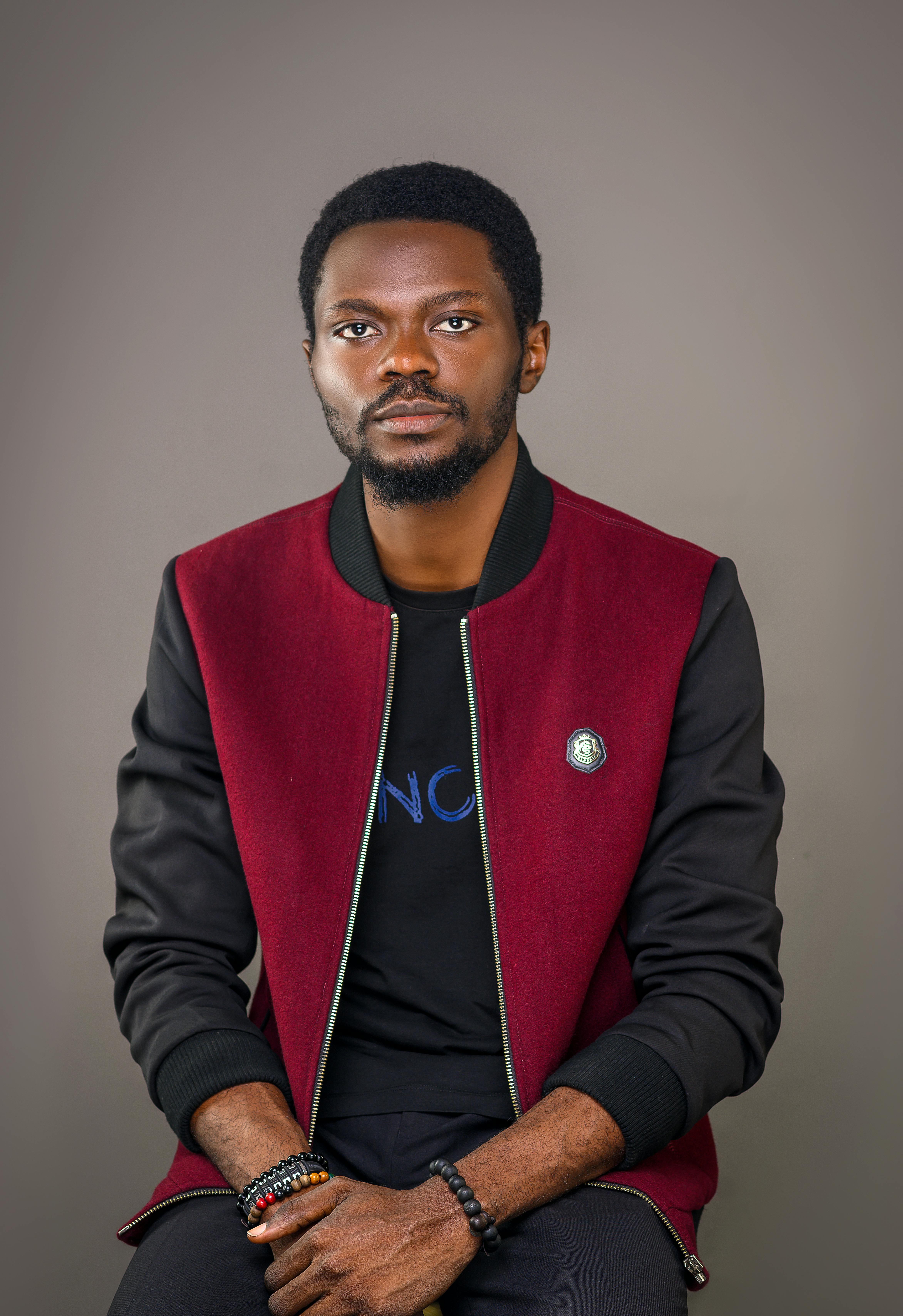 Man in Red Bomber Jacket with Black Sleeves · Free Stock Photo