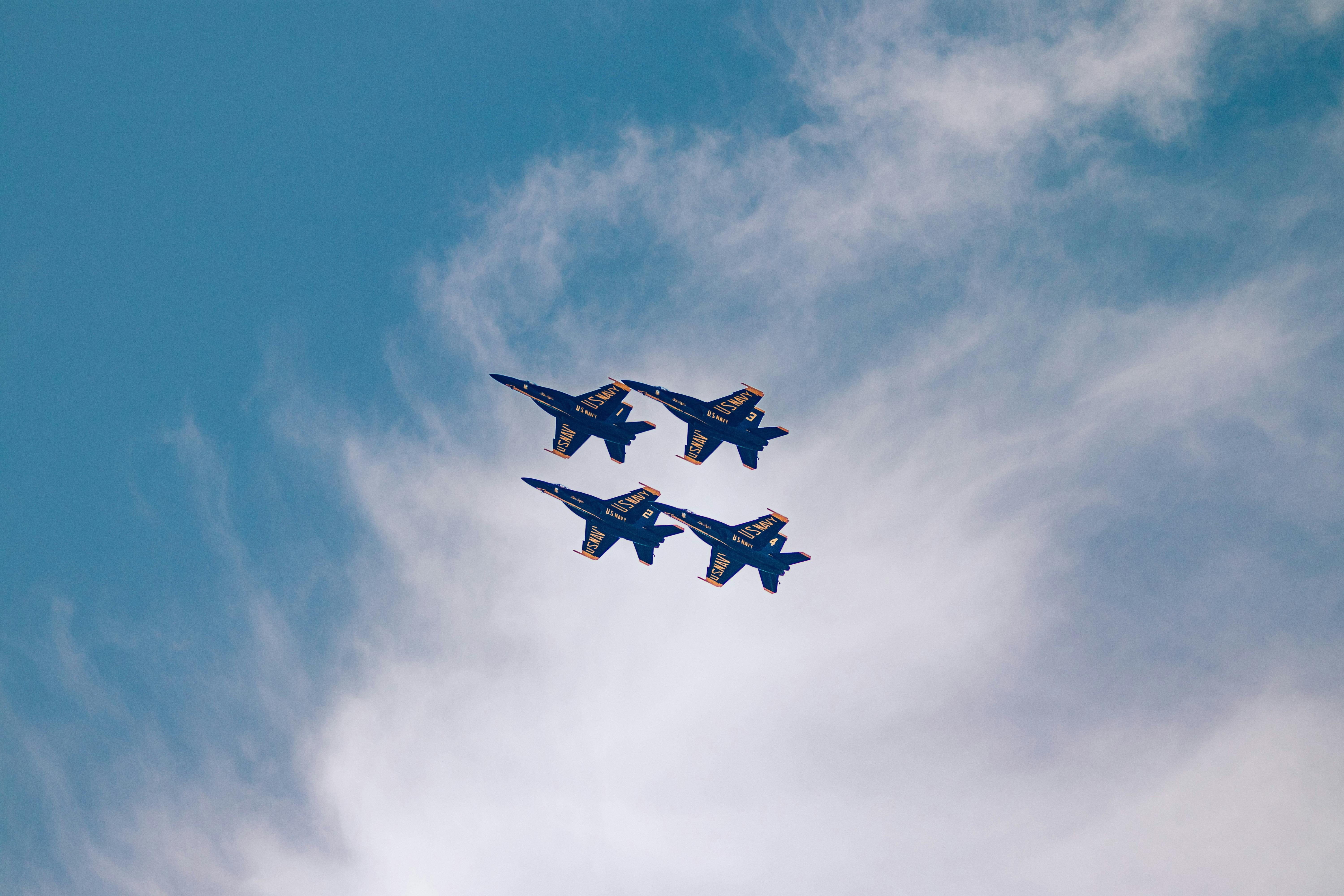 Four jets flying in formation · Free Stock Photo