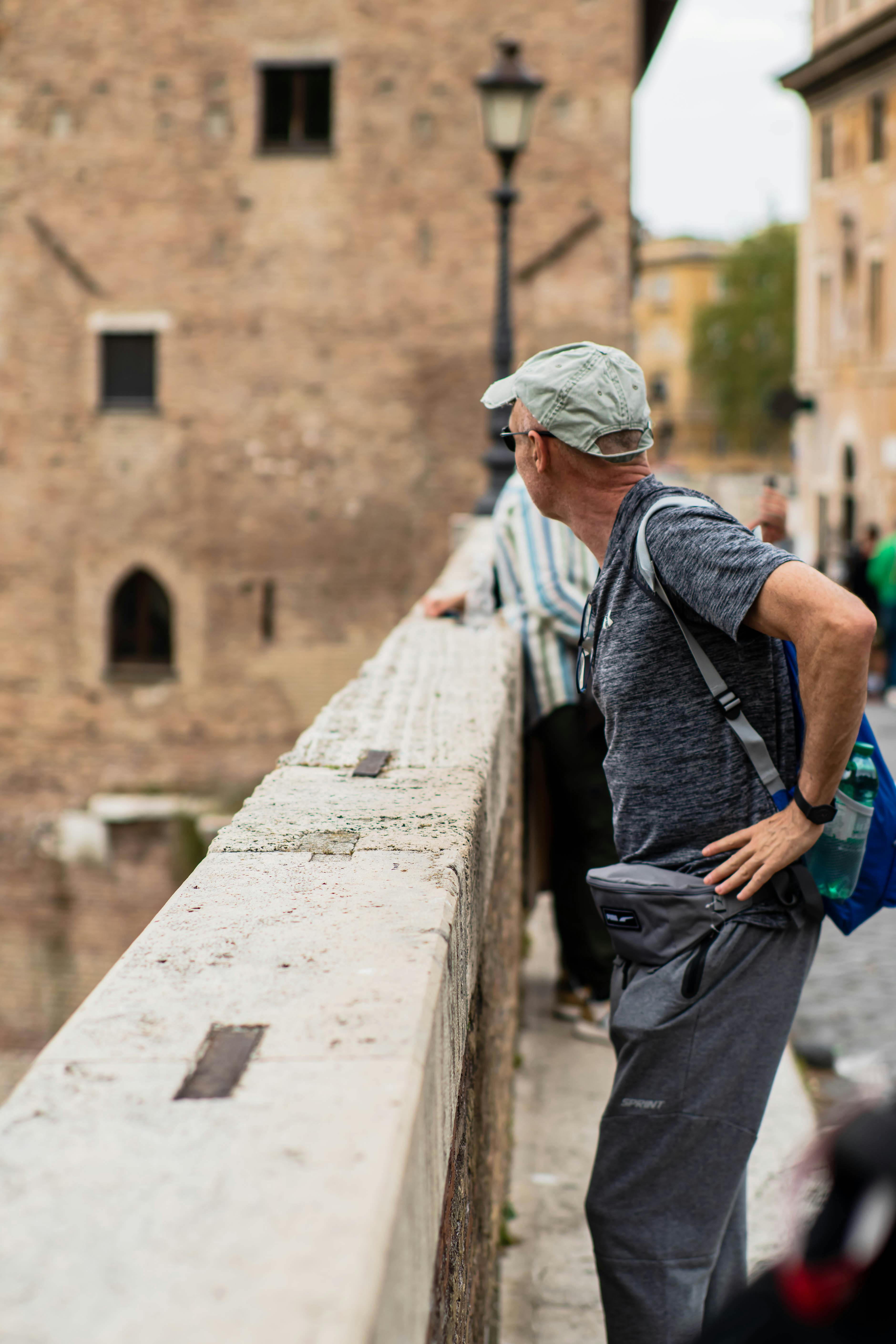 Man Standing on Bridge in Rome · Free Stock Photo