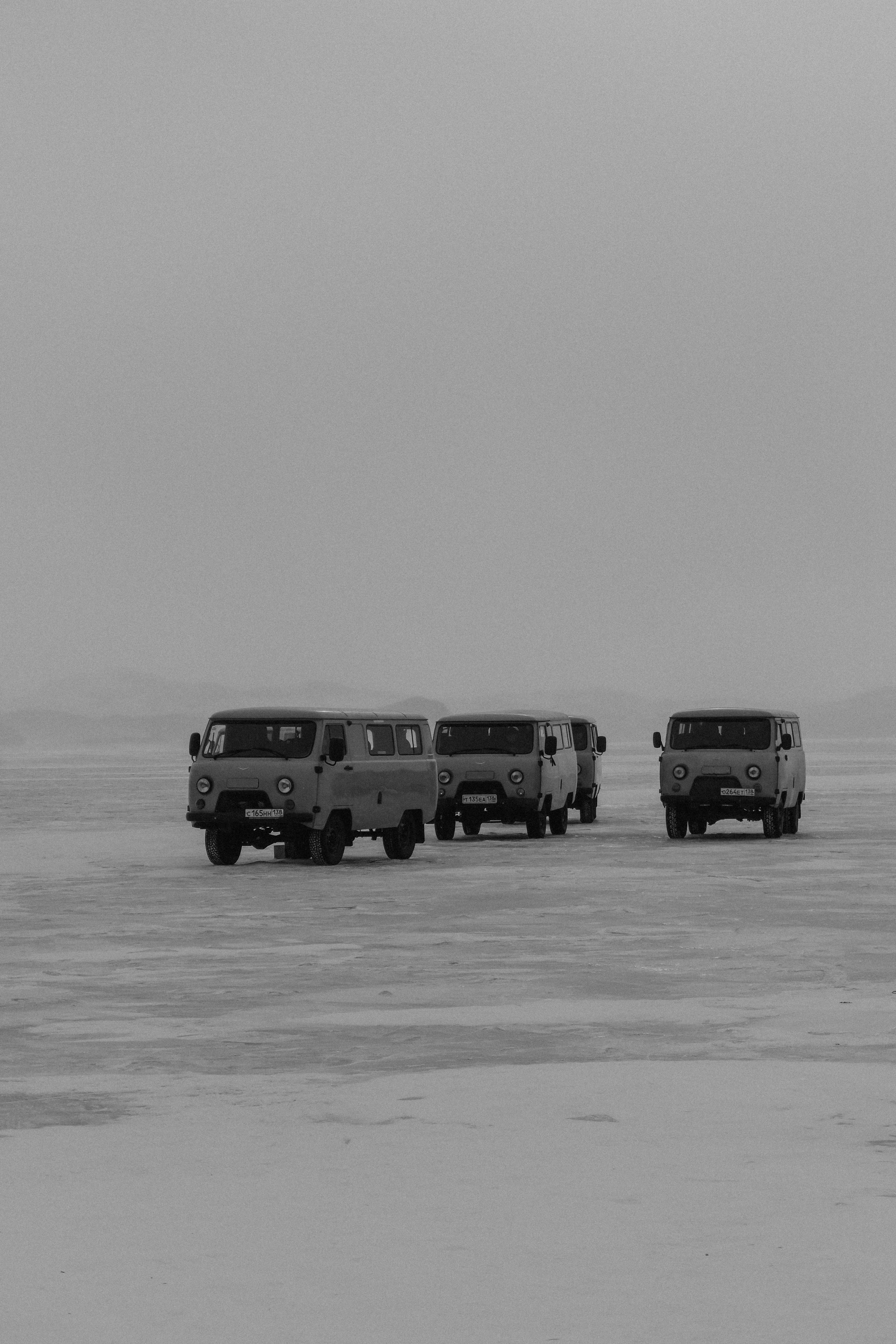 View of UAZ-452 Trucks on a Snowy Surface · Free Stock Photo