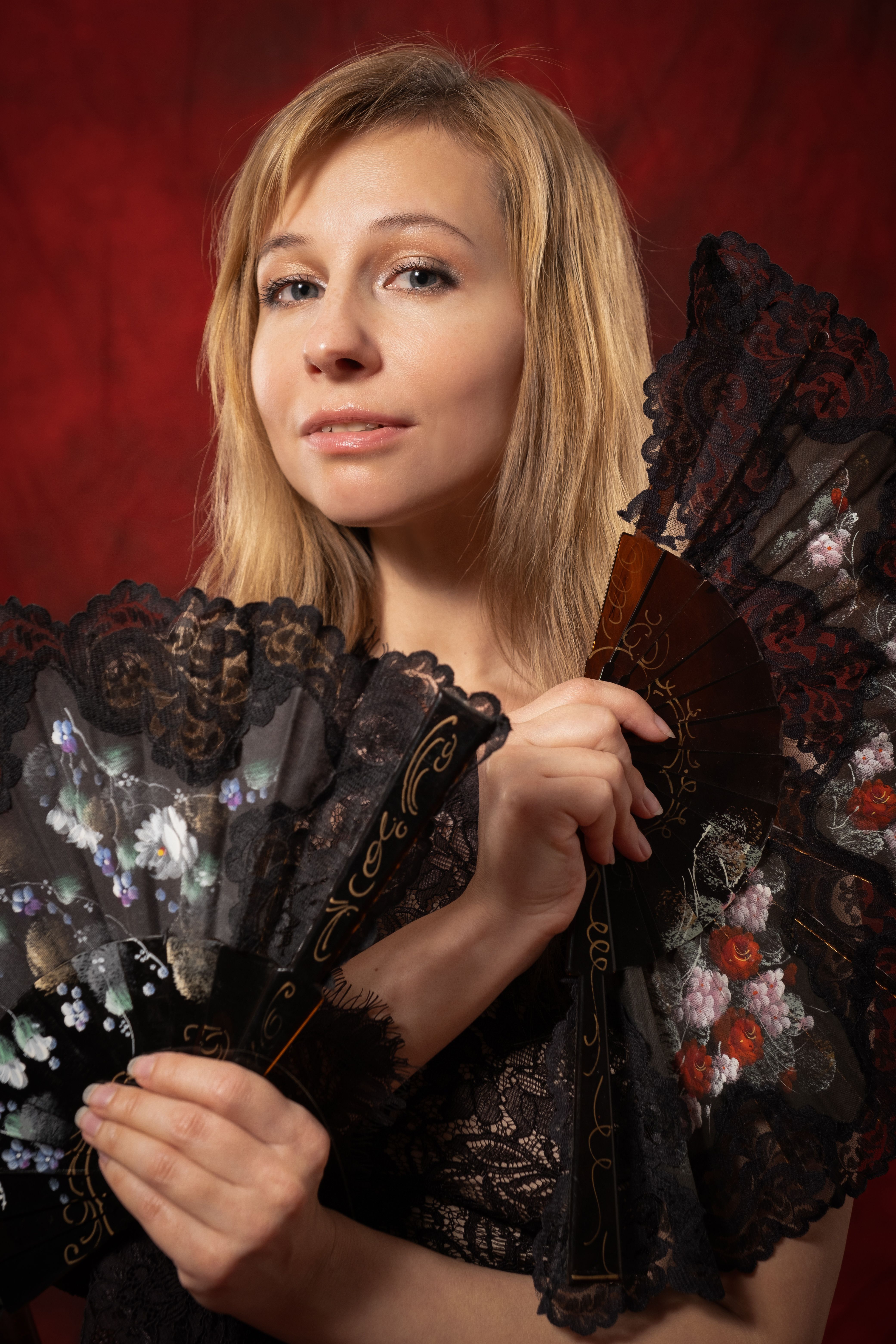 Portrait of a Woman with Hand Fans · Free Stock Photo