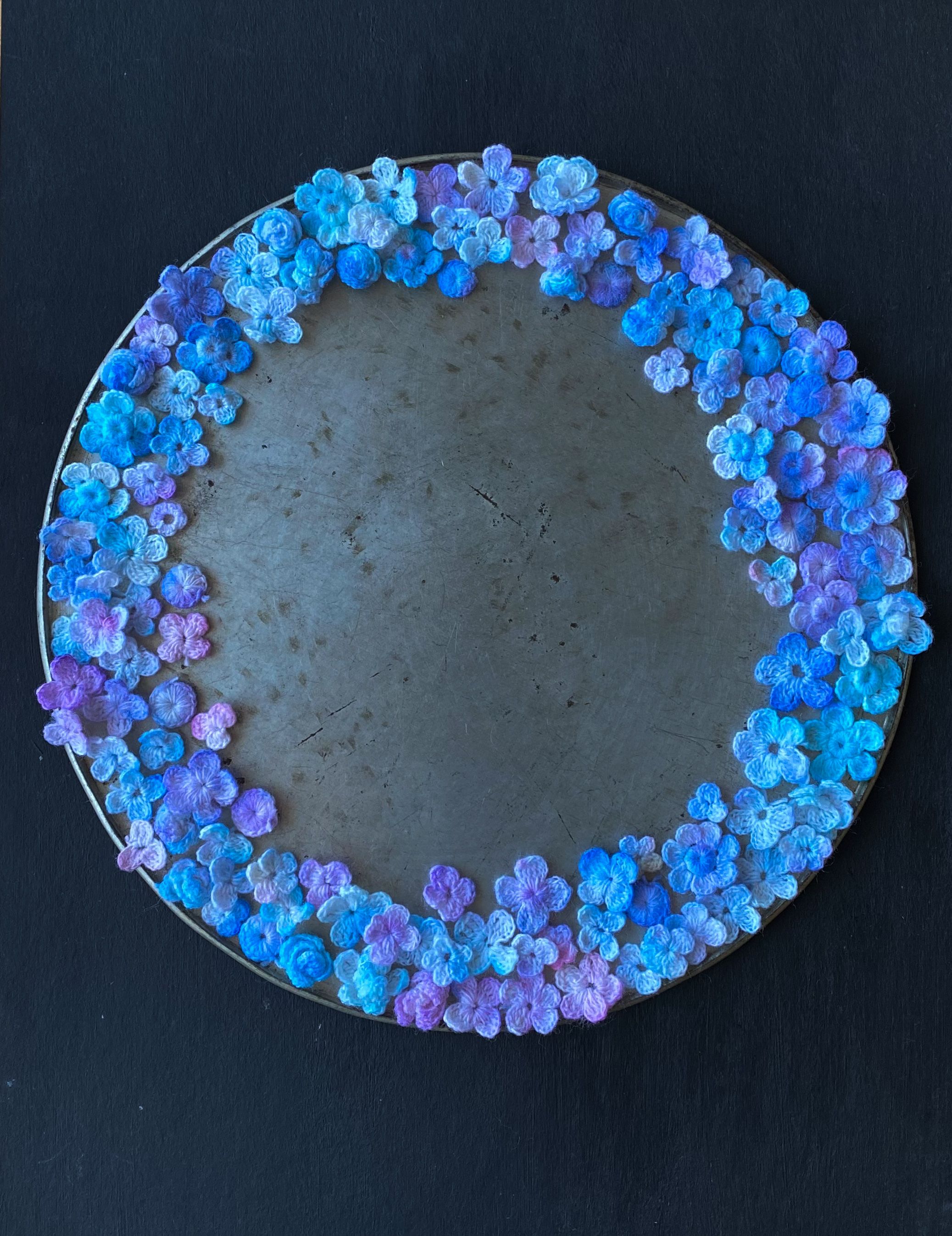 Blue Flowers Around Metal Plate · Free Stock Photo