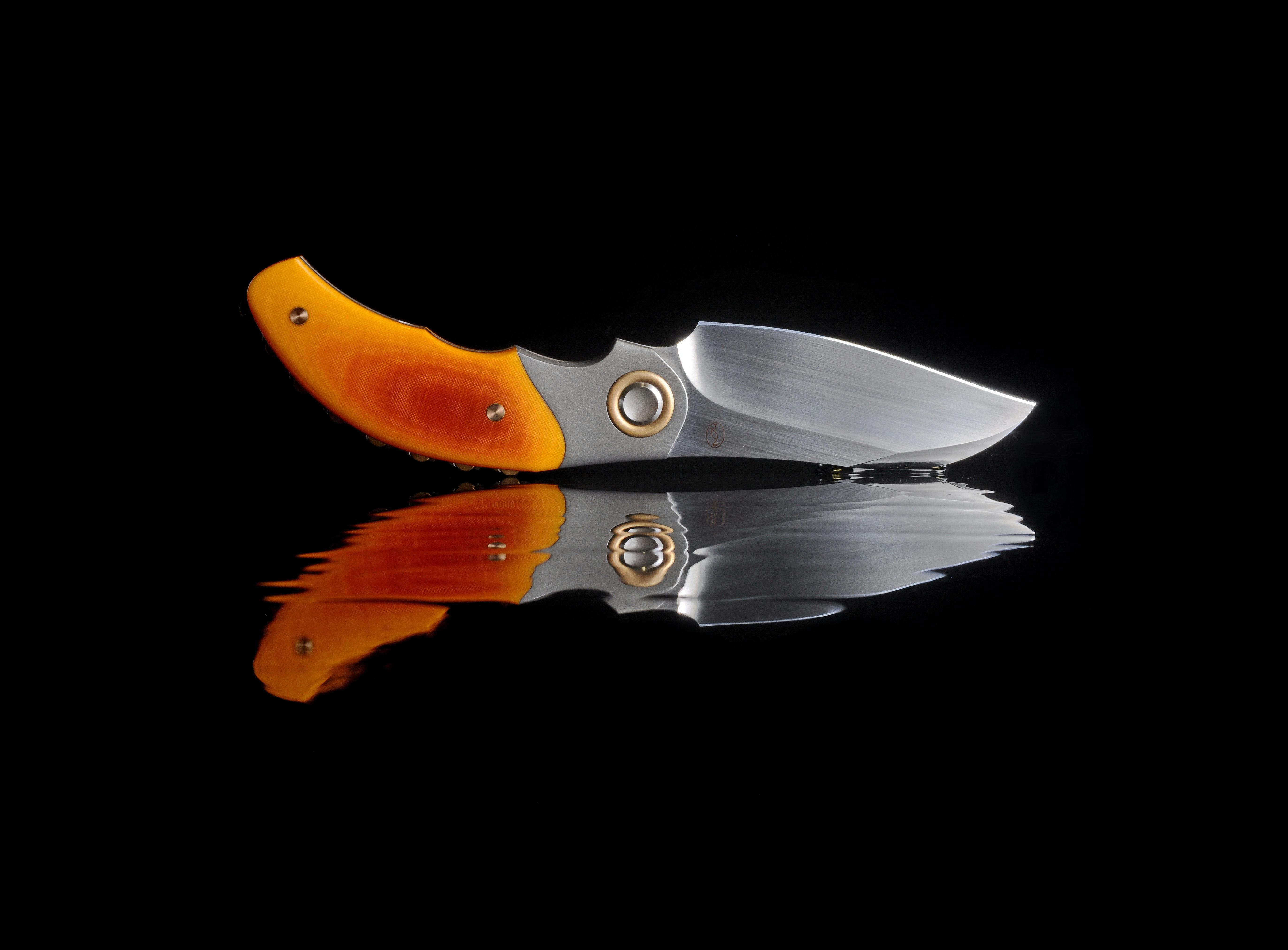 Unfolded Pocket Knife Reflecting in the Water Surface · Free Stock Photo