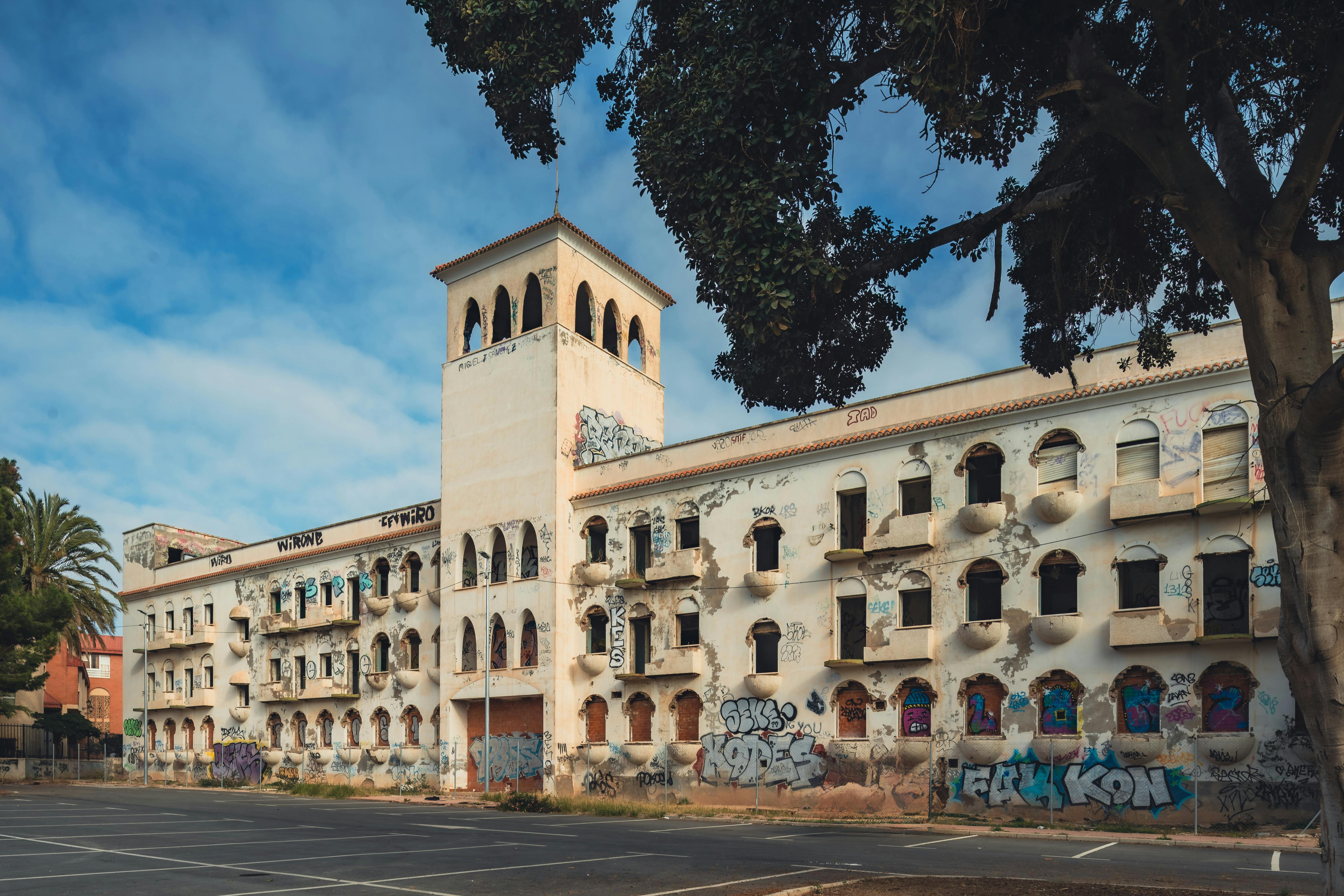 Decrepit Building with Tower · Free Stock Photo