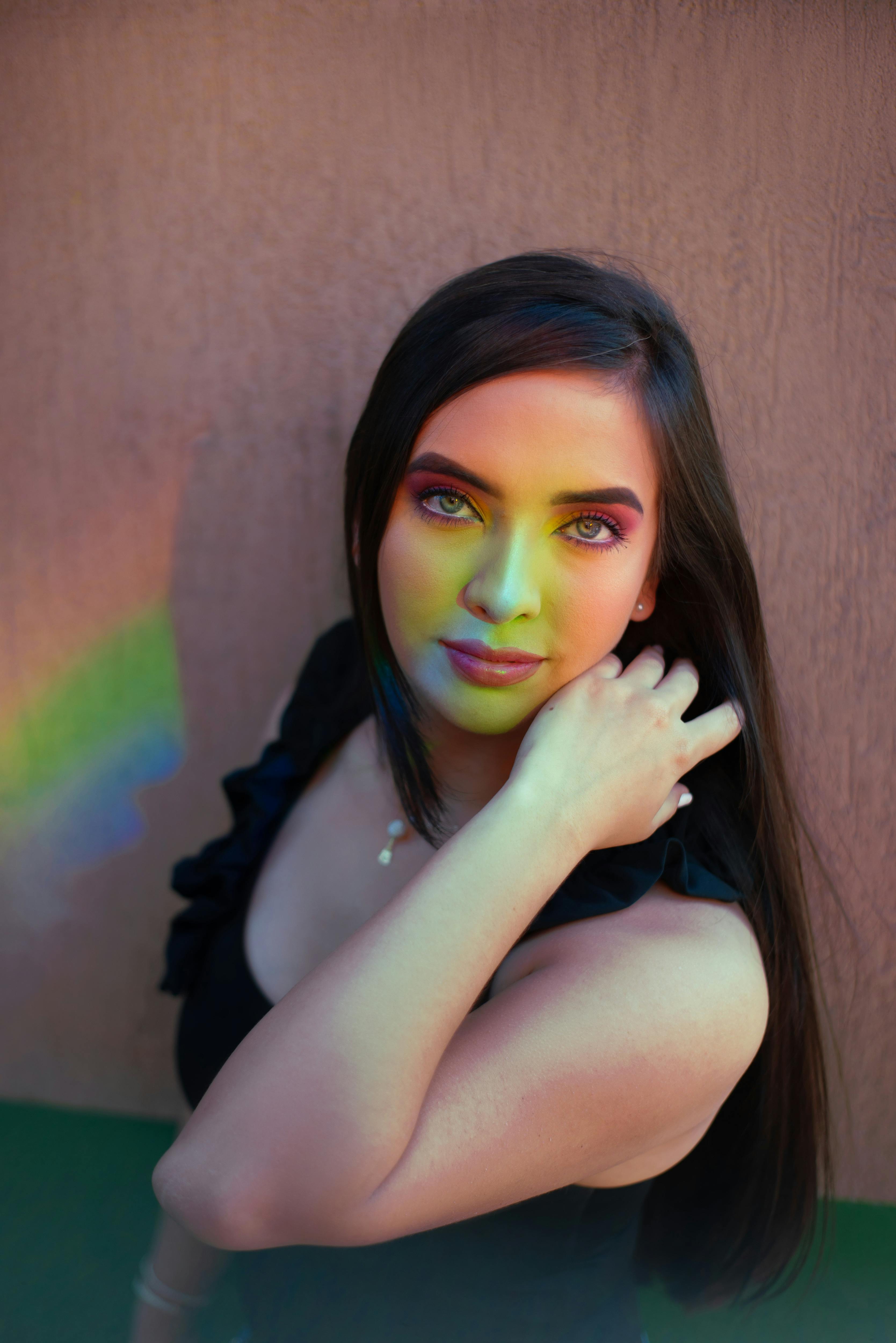 Young Woman in the Rainbow Light of a Prism · Free Stock Photo