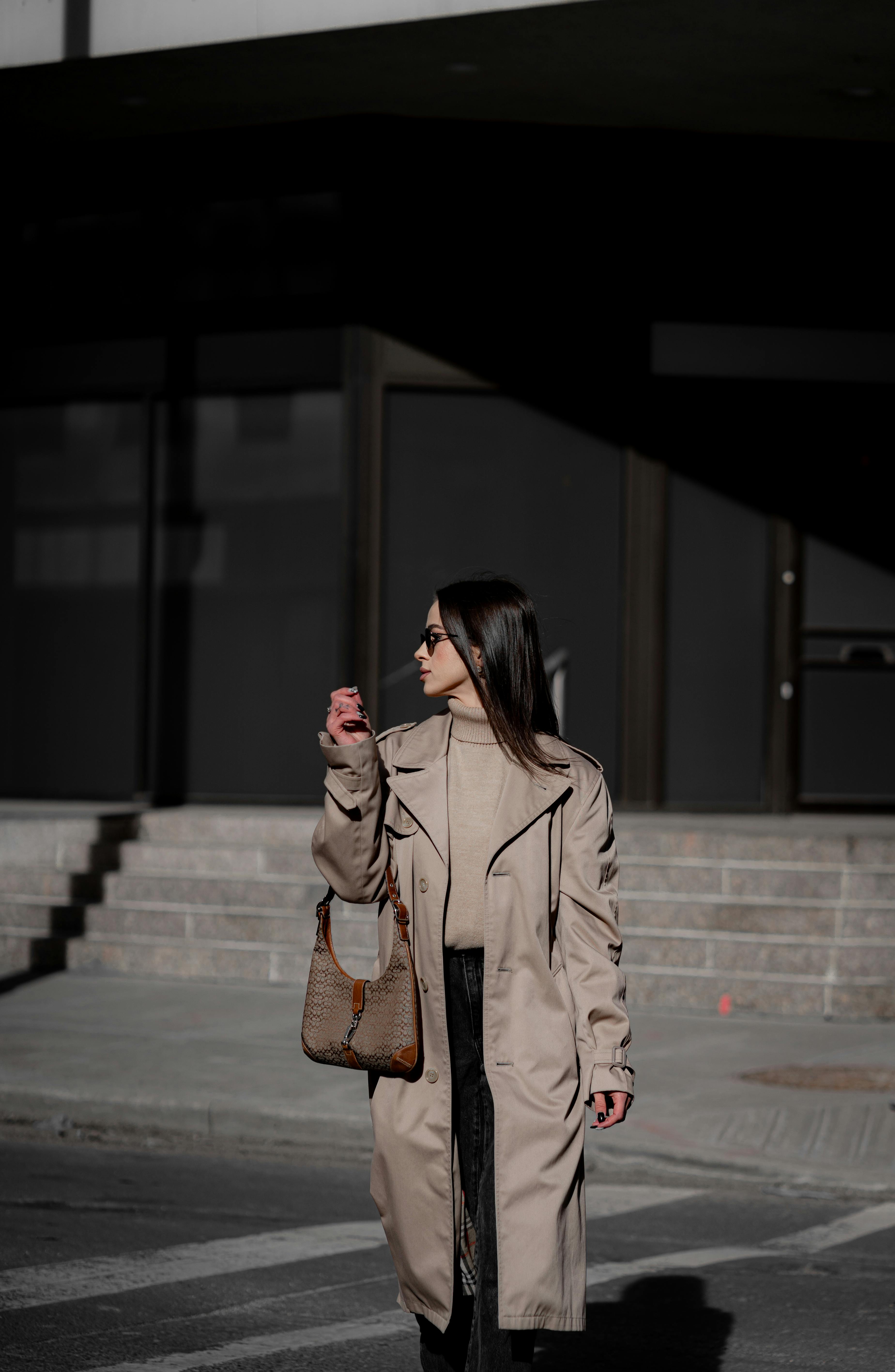 Brunette Woman Model in Beige Coat Walking on Street · Free Stock Photo